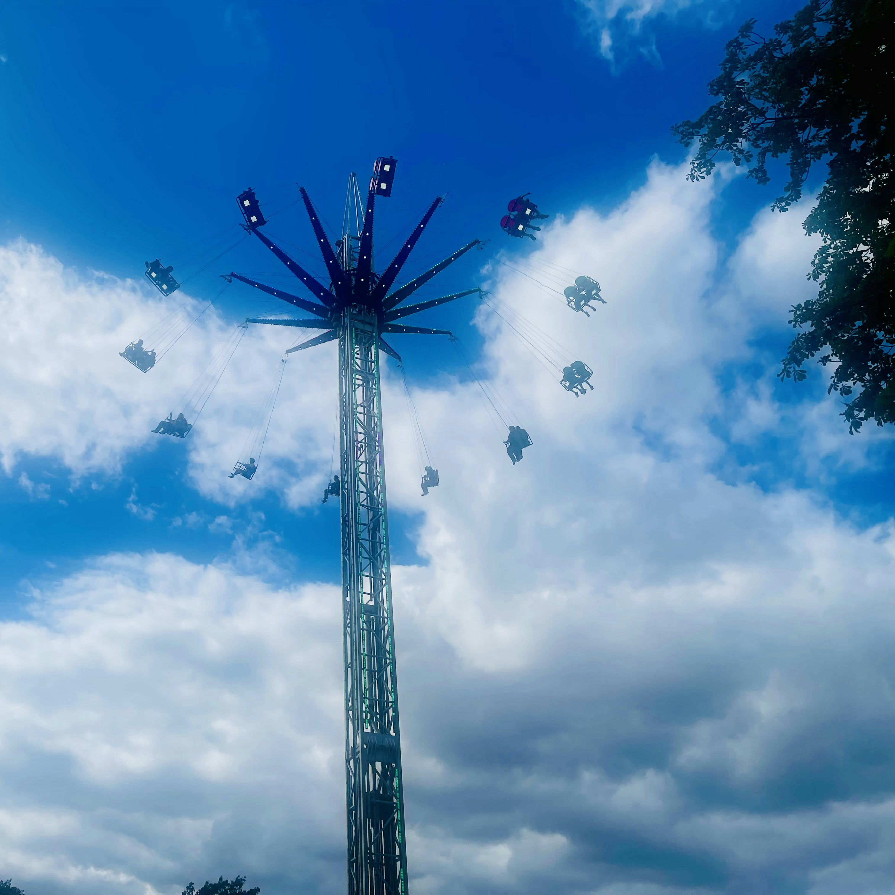 Skyward Arcade: A Tower of Daring Swings Beneath a Brisk Blue Canopy
