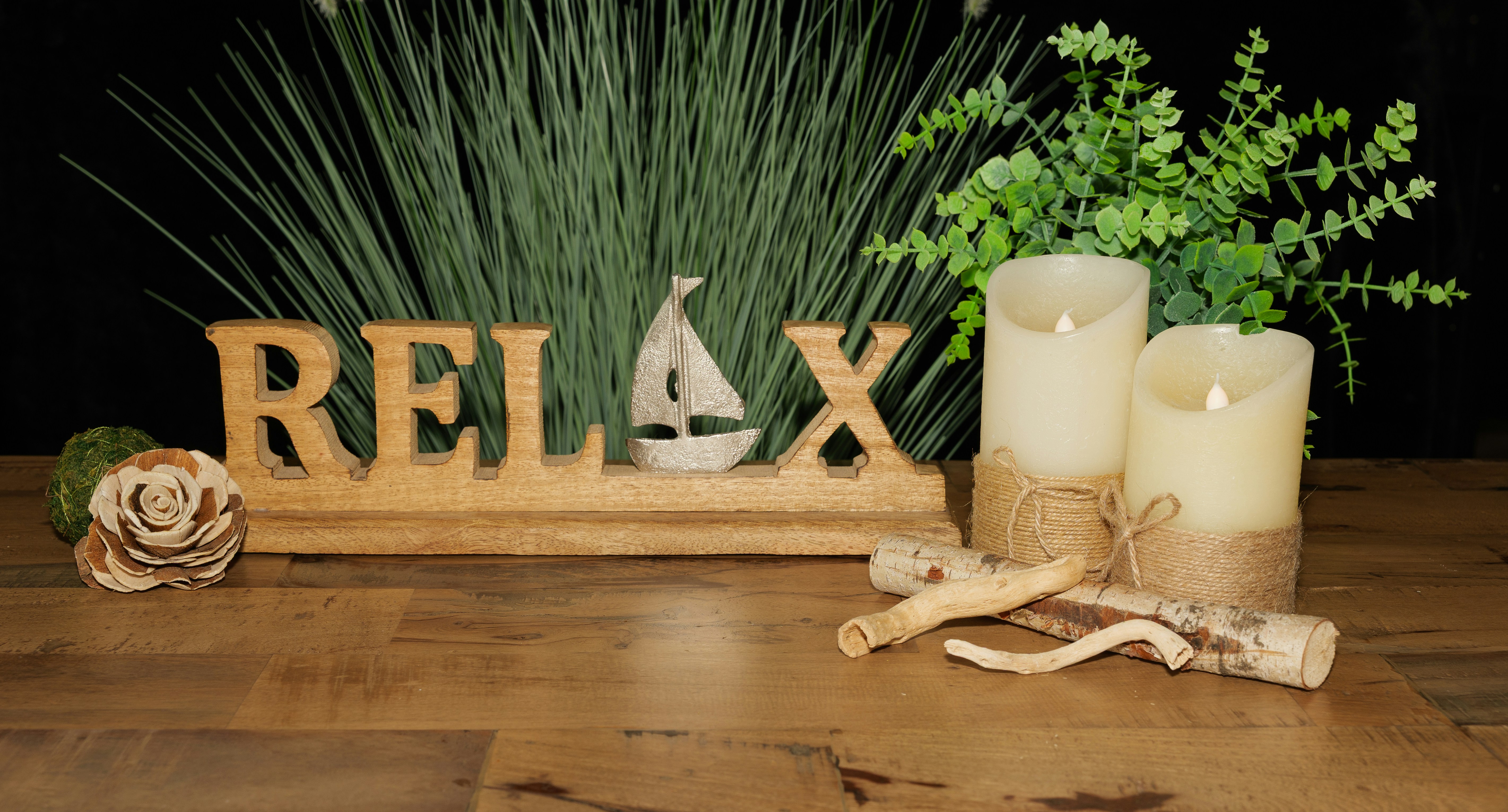 Relaxation Sign: Rustic Studio Still with Wax Cylinders and Greenery