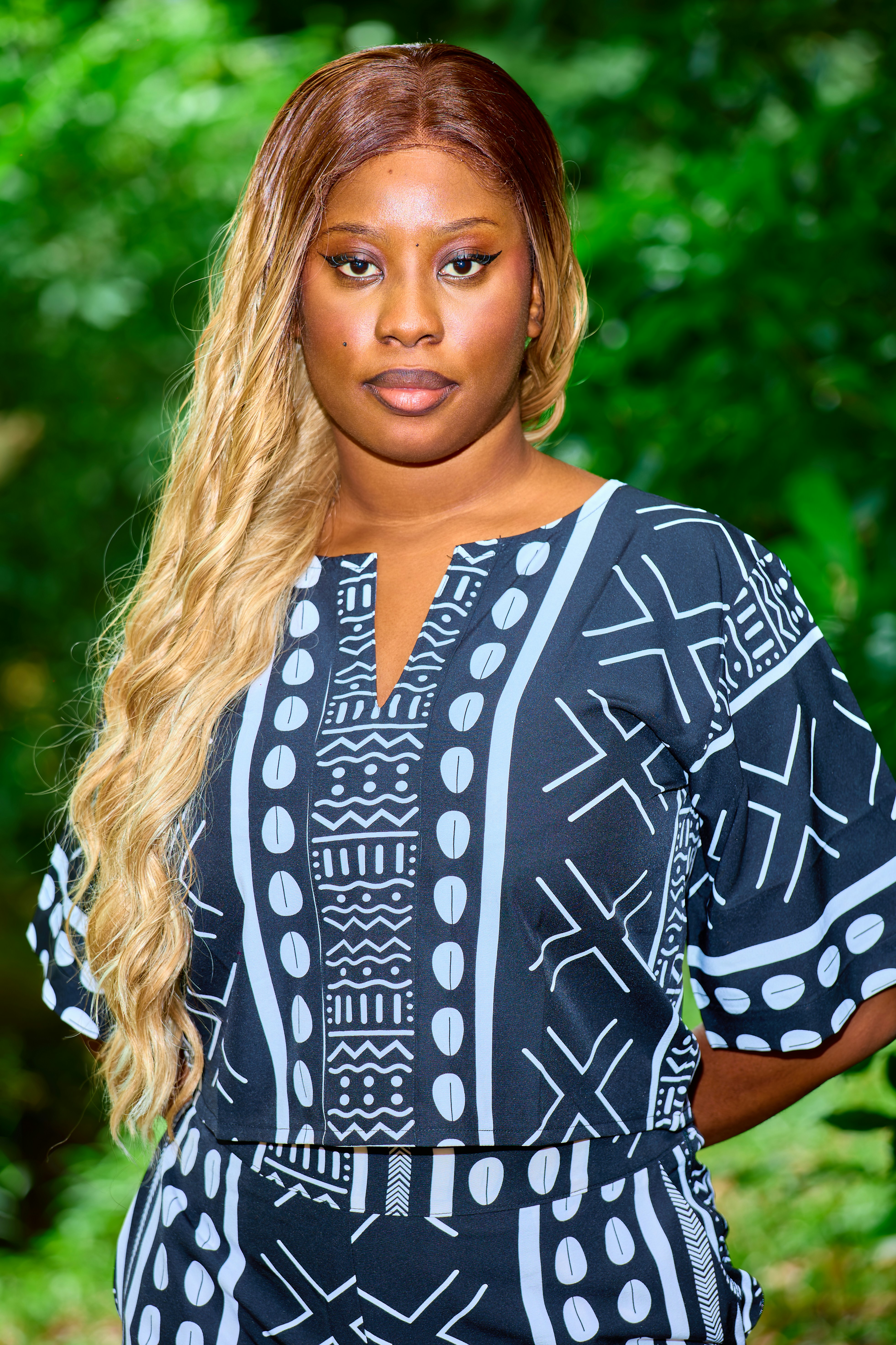 Emerald Garden Portrait: A Bold Presence in Patterned Attire