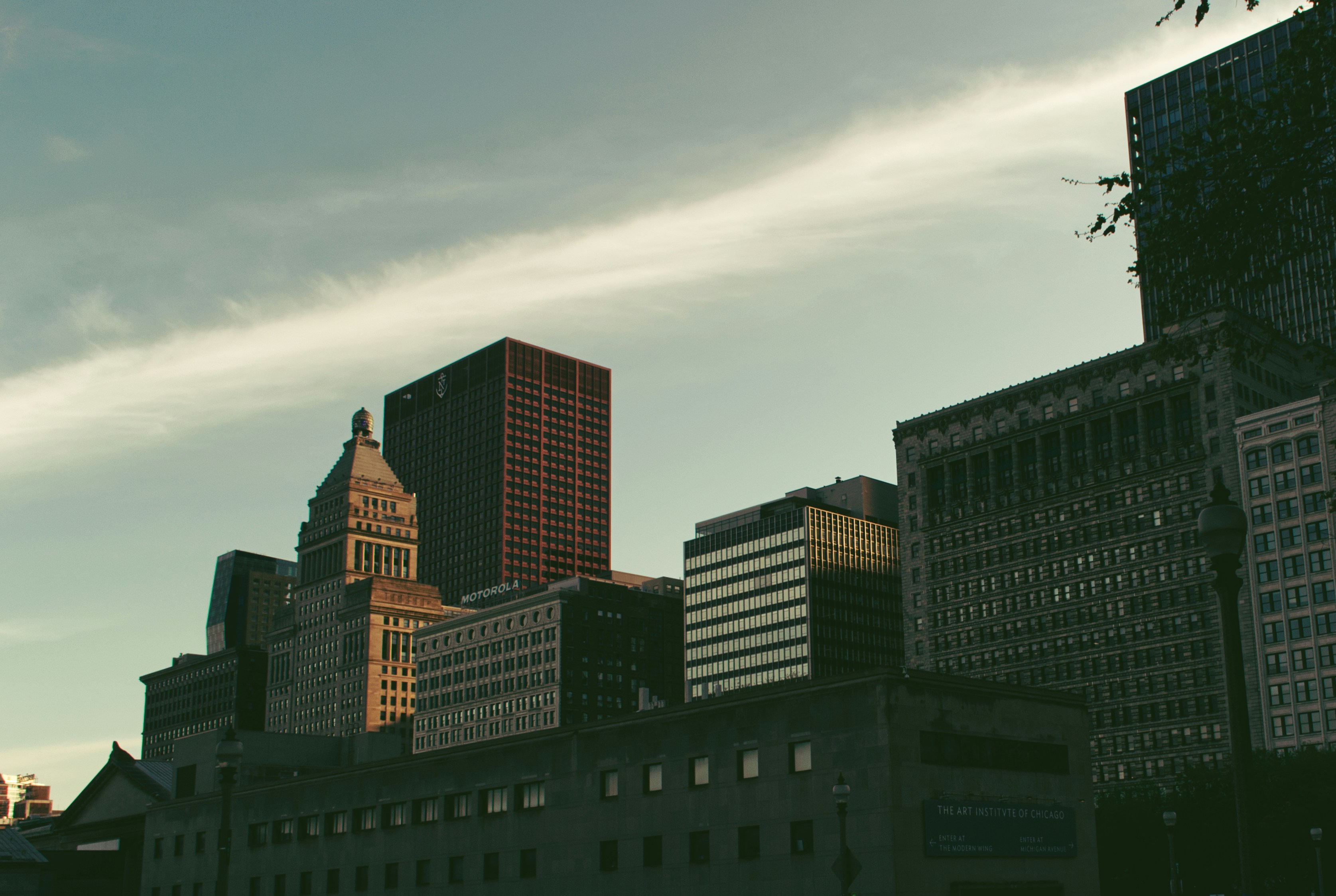 City Skyline at Dusk: Quiet Towers Loom Over a Street-Level Terrace