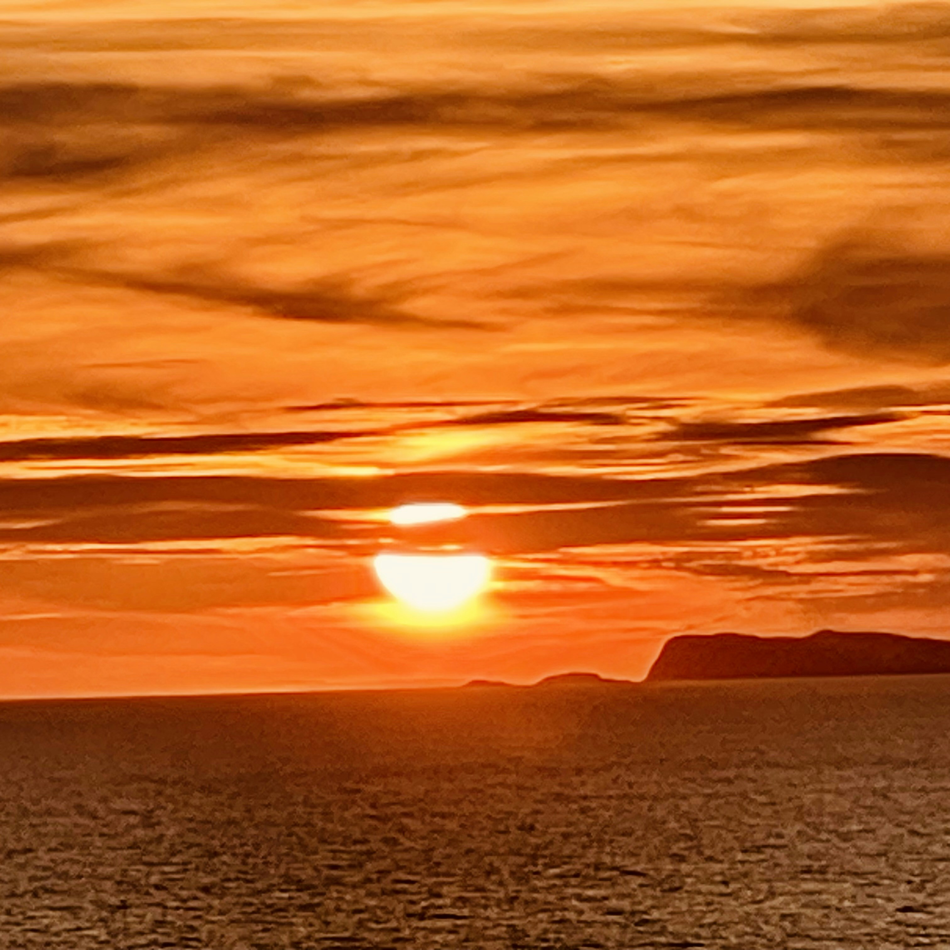 Glowing Horizon: Sunset over Quiet Sea