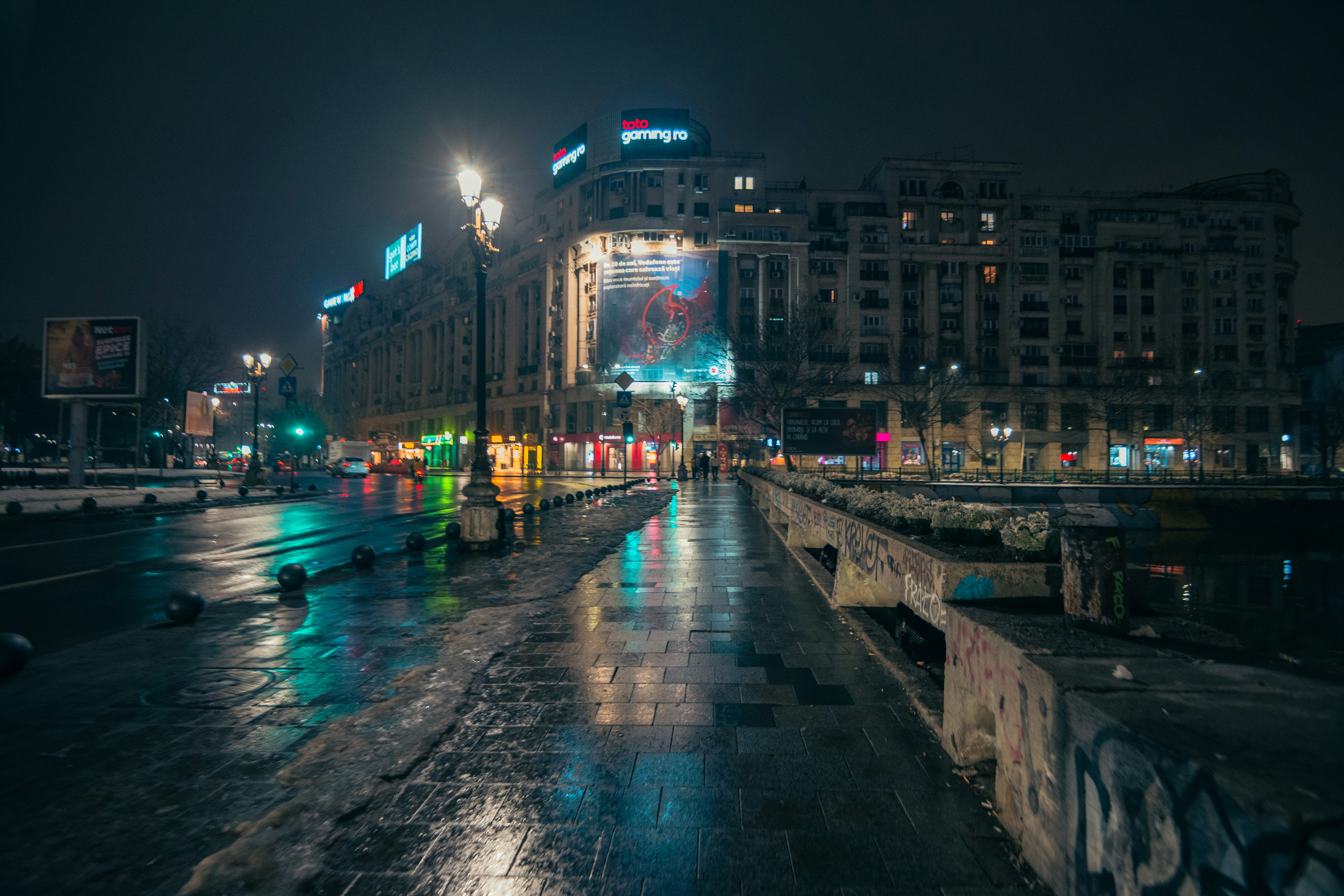 Neon Reflections on a Rain-Slick Promenade