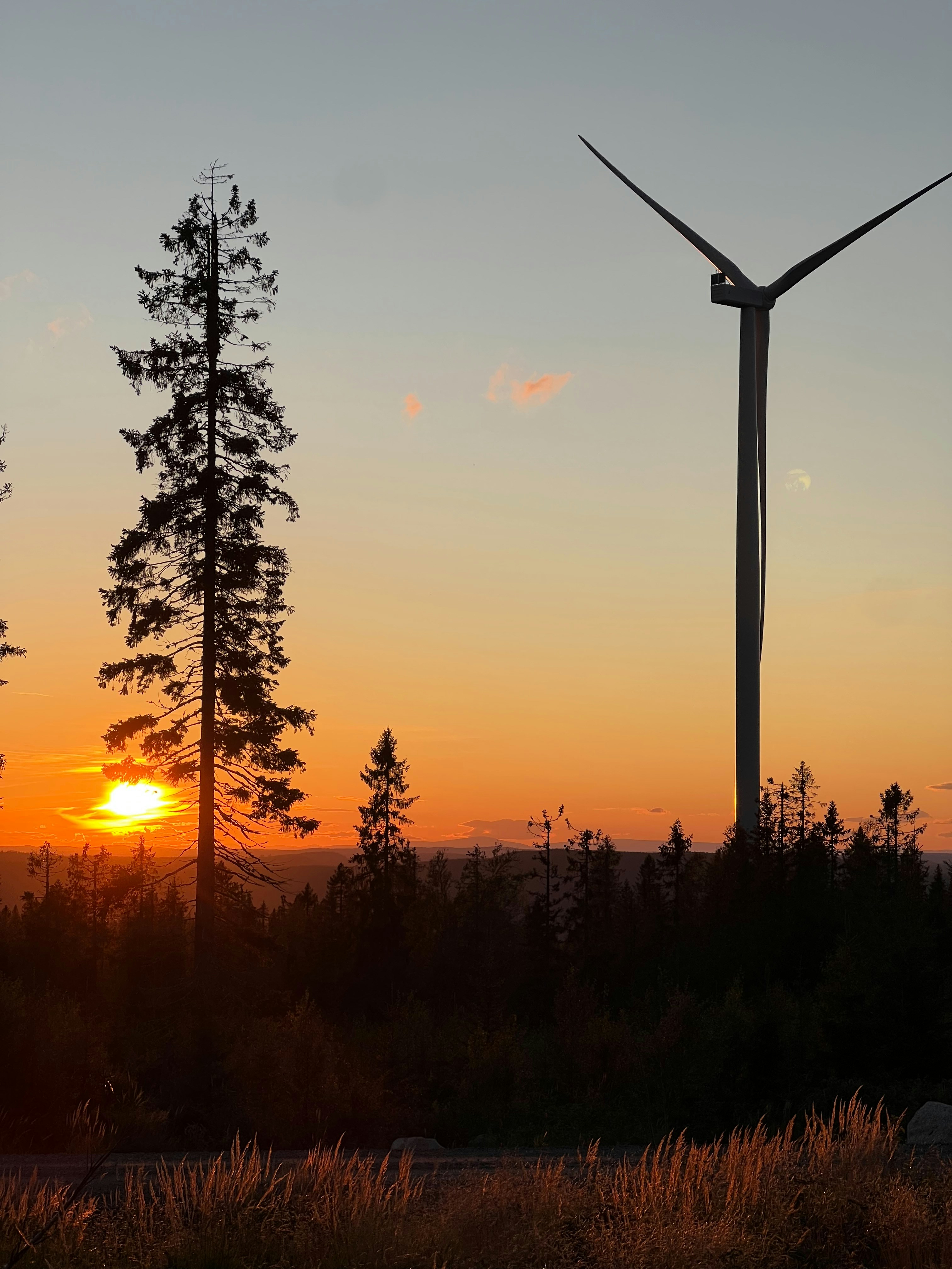 Sunlit Windmill Silhouette at Dusk