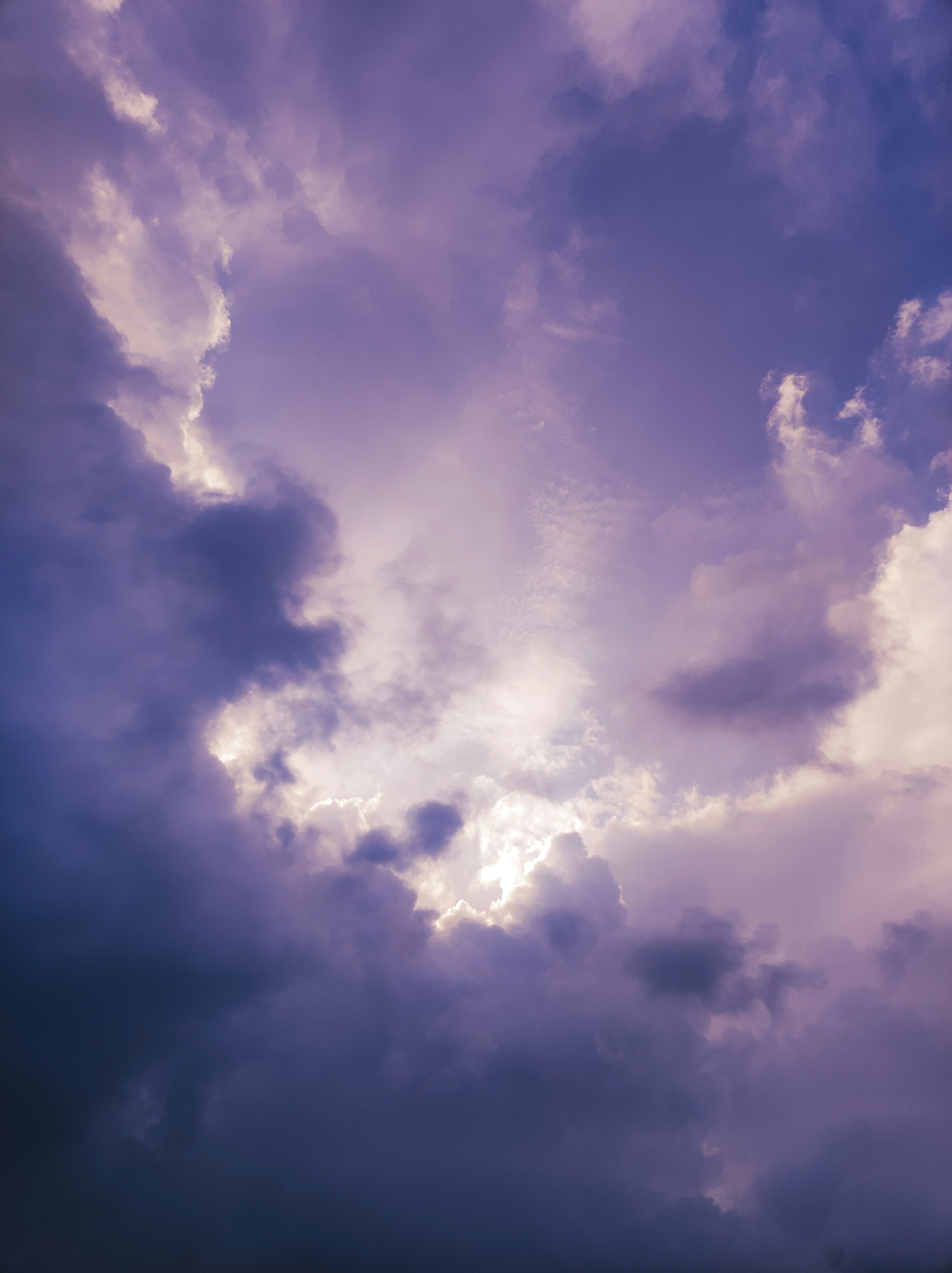 Violet Skybreak: Sunlit Cumulus Piercing Lavender Clouds