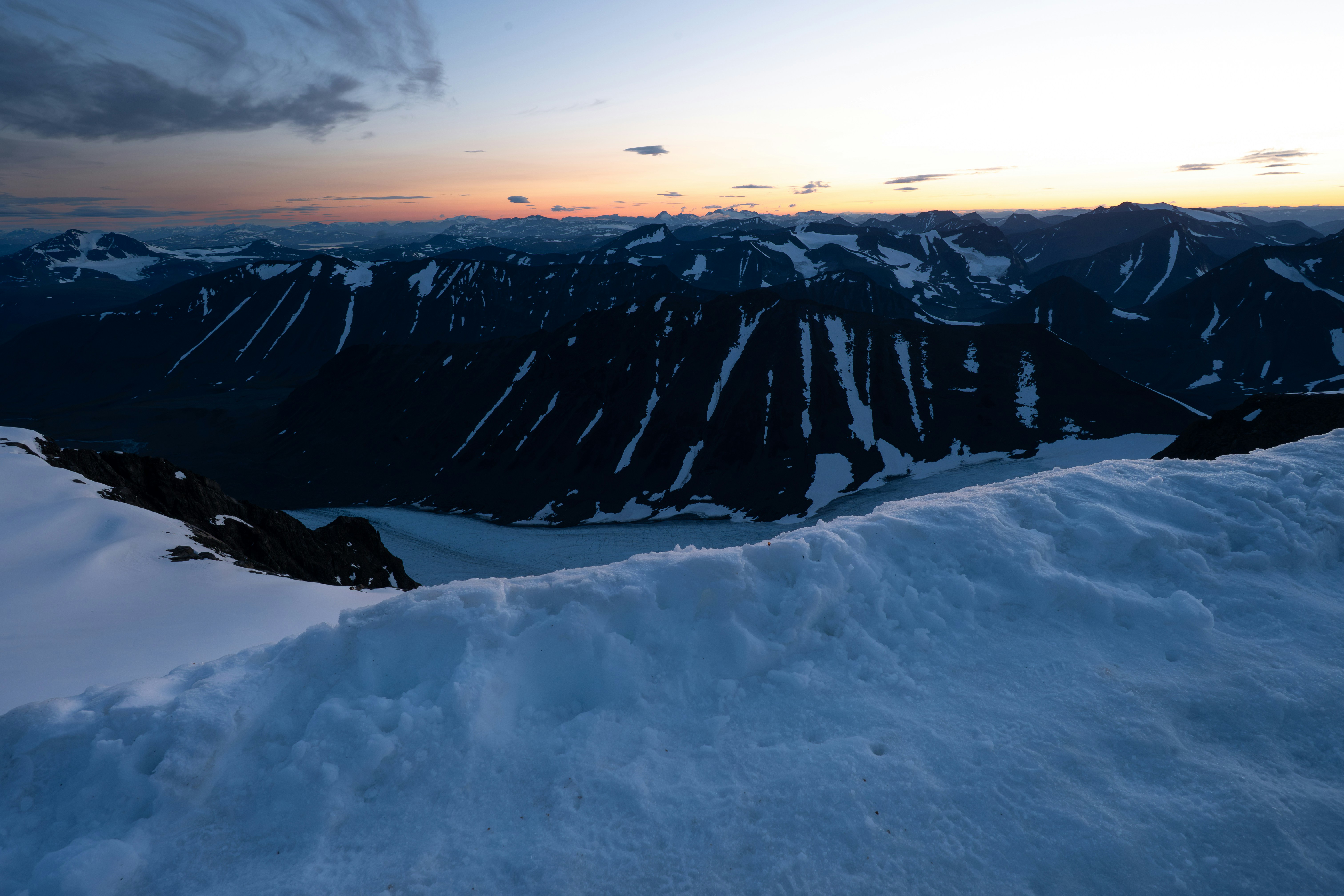 Distant Sundown Over Snow-Capped Depths