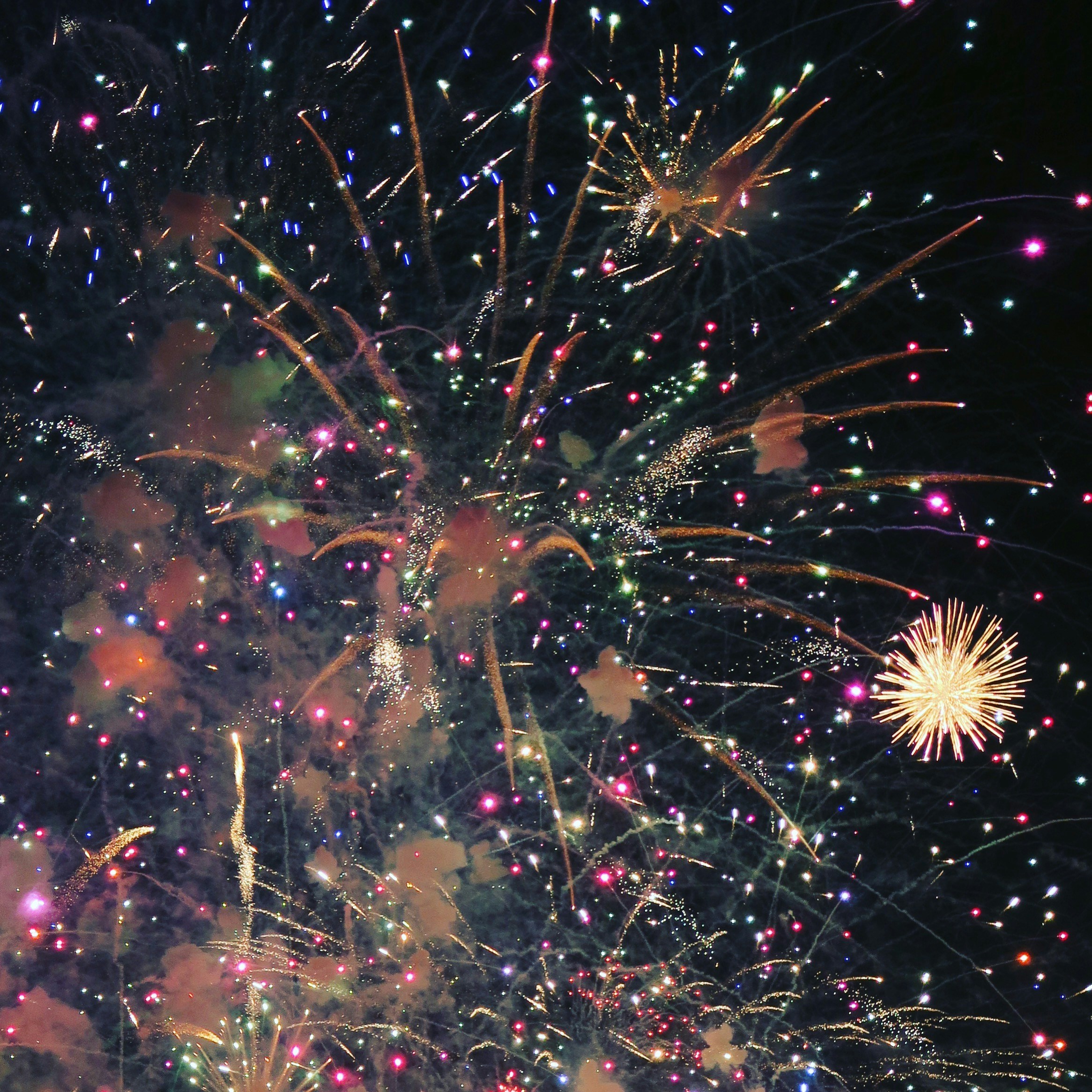 Midnight Burst: Fireworks Framing a Lantern of Light