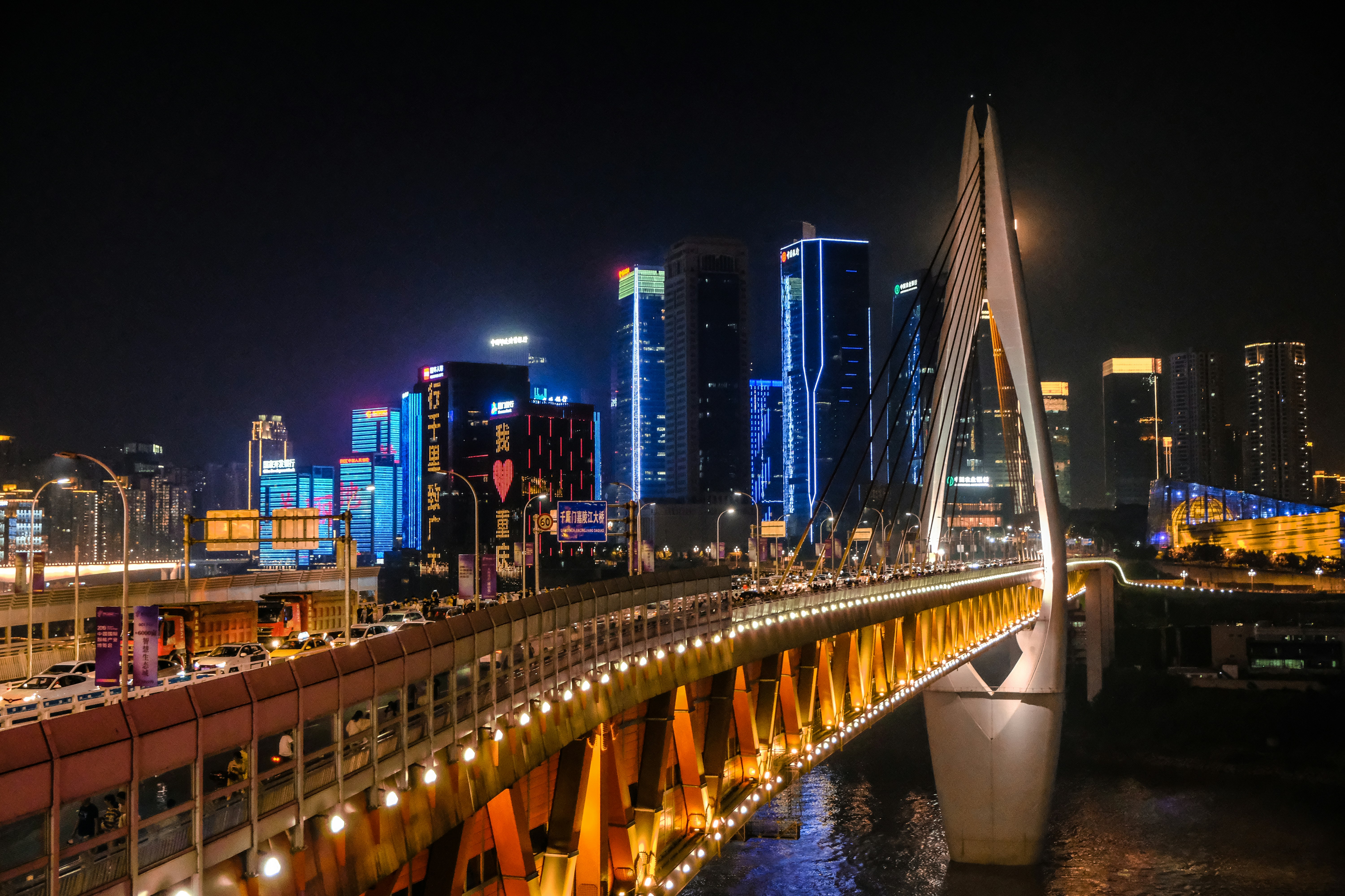 City of cables: illuminated bridge weaving through a glowing skyline