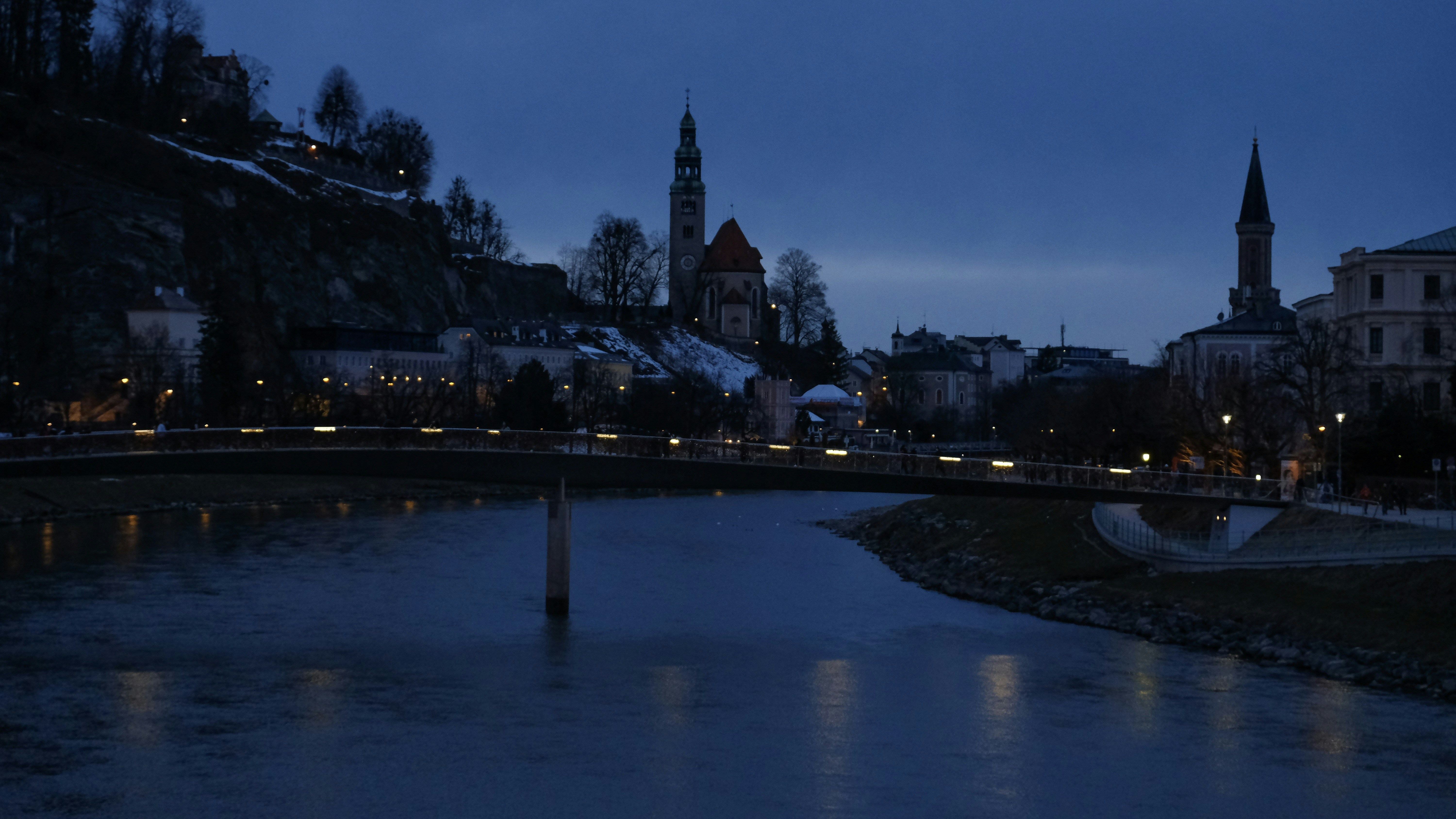 Evening on the River: City Silhouette Under a Velvet Sky