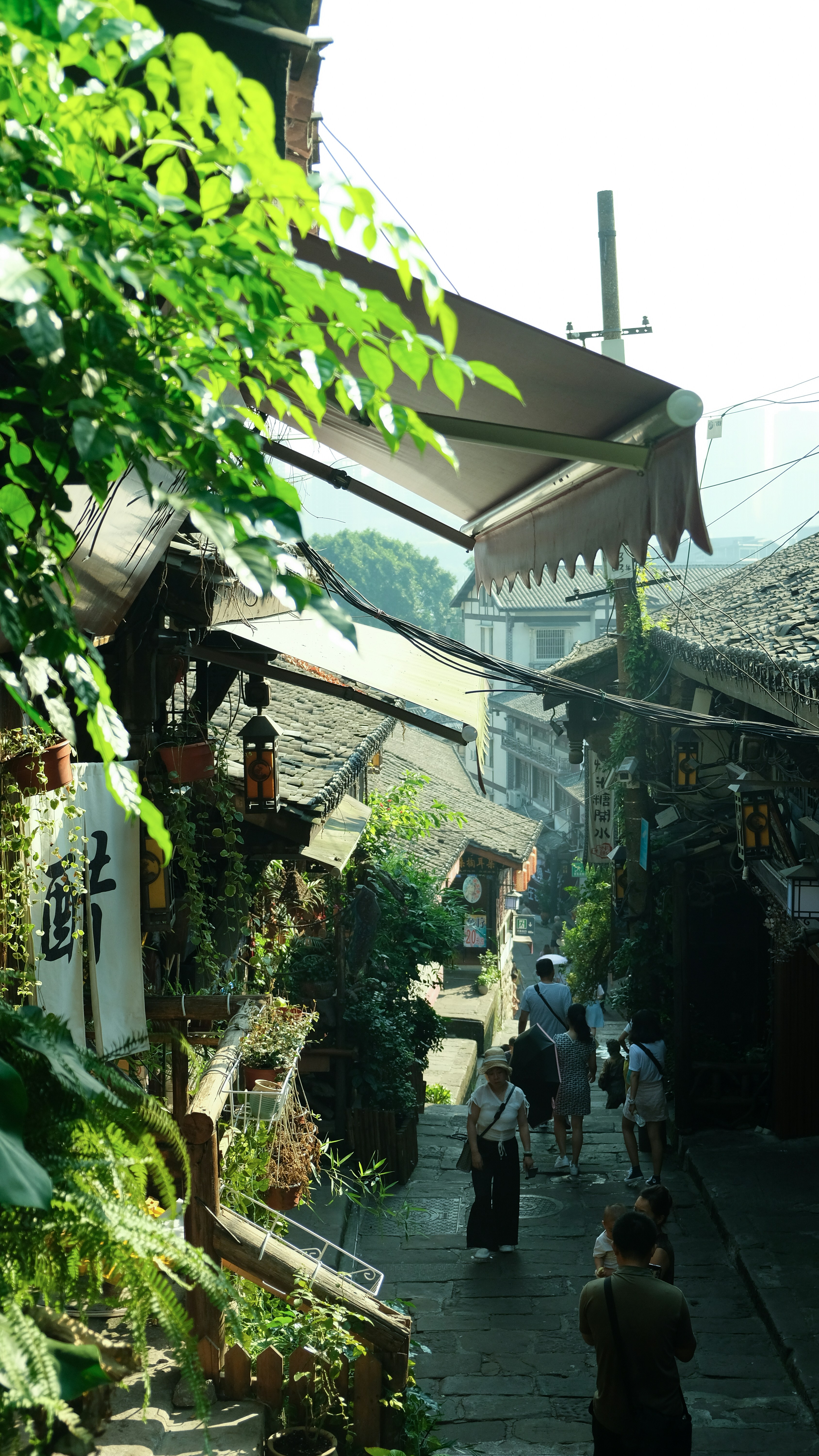 Sunlit Alleyway: Quiet Climb Through a Traditional Village