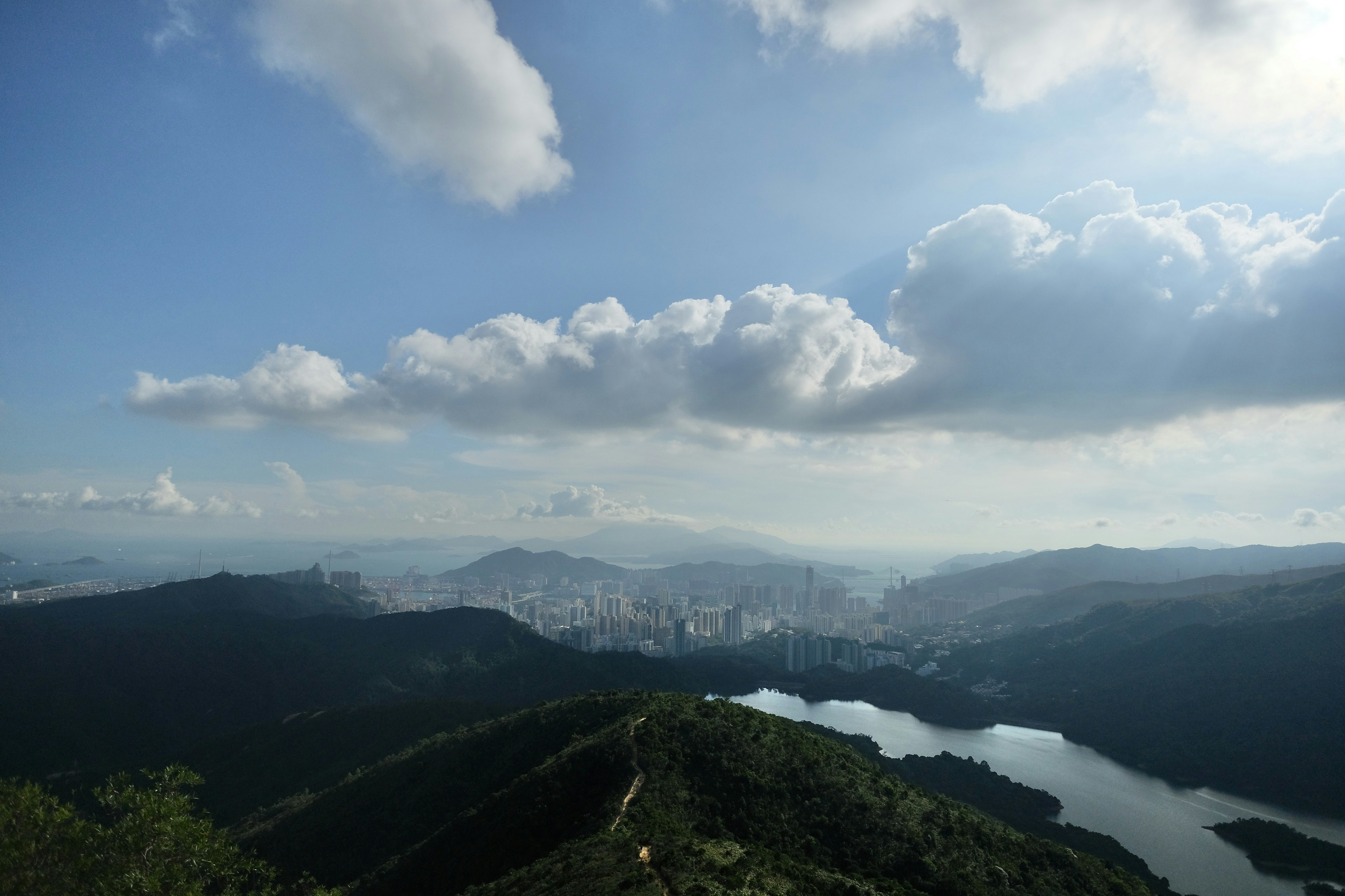 Quiet City Nestled Between Green Ridges and a Winding Waterway
