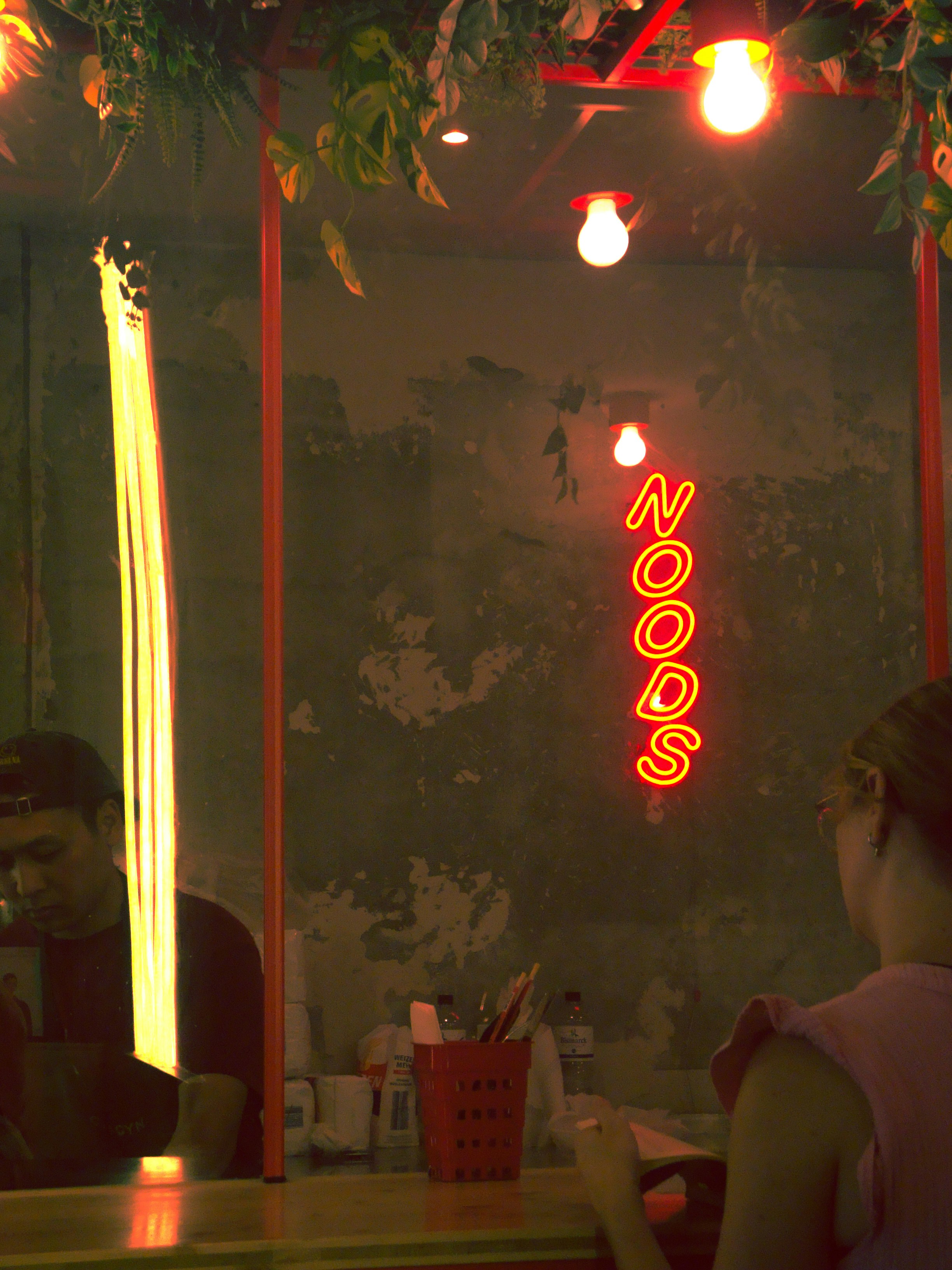 Neon Nook: Quiet Conversation by the Glowing Sign