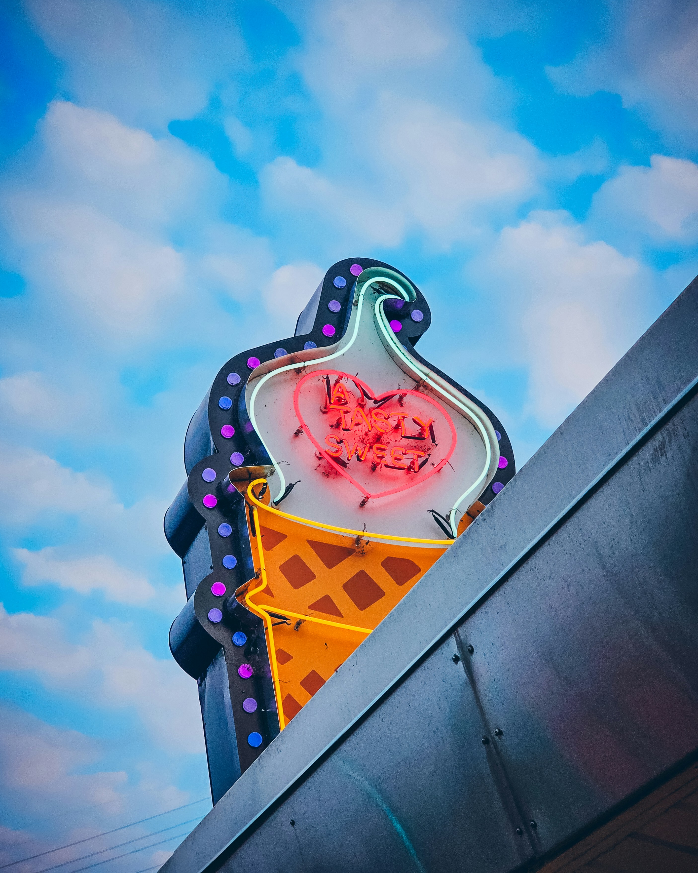 Neon Ice Cream Sign Reaching for the Sky