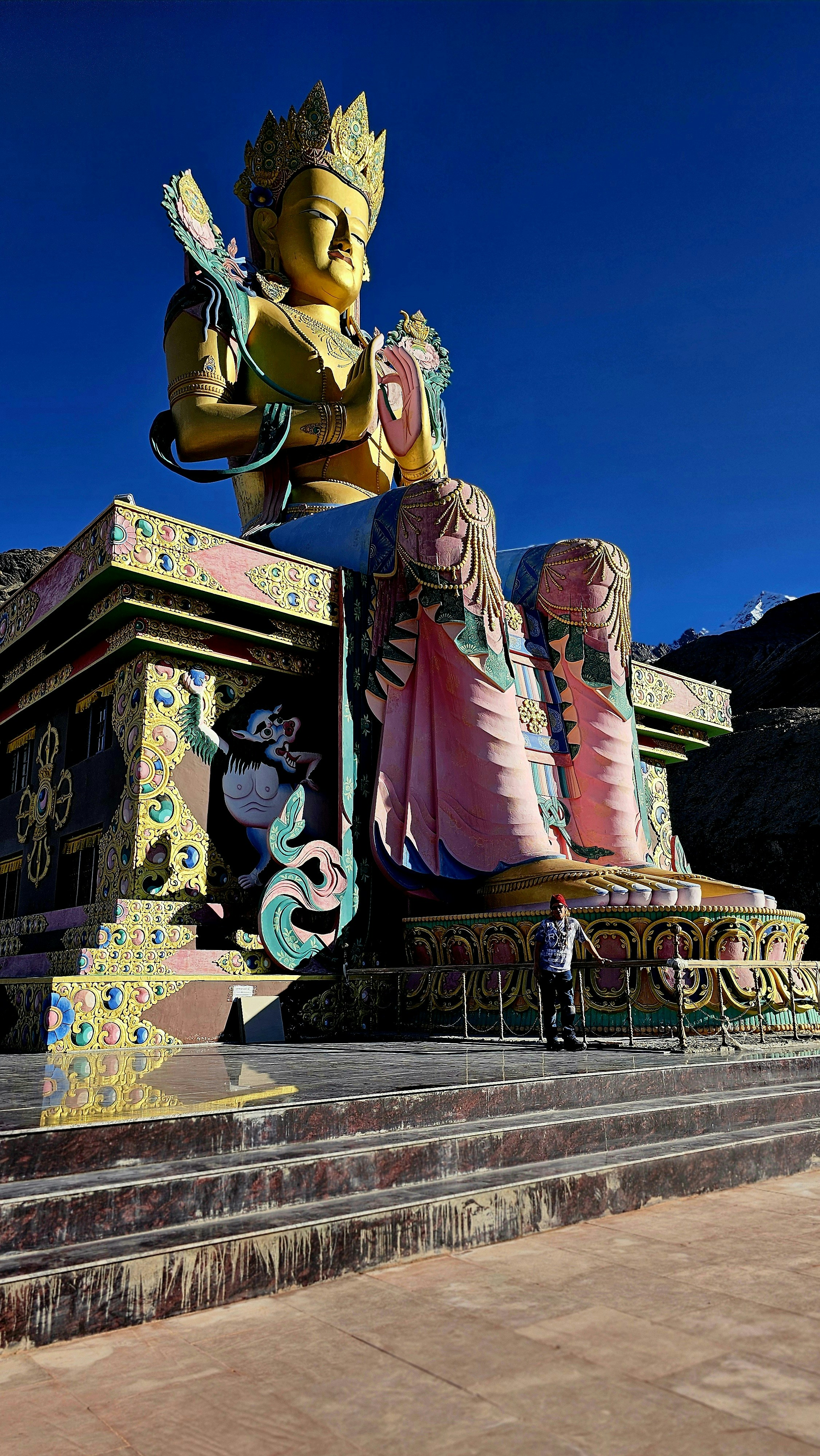 Giant Buddha Statuary Under Alpine Sky