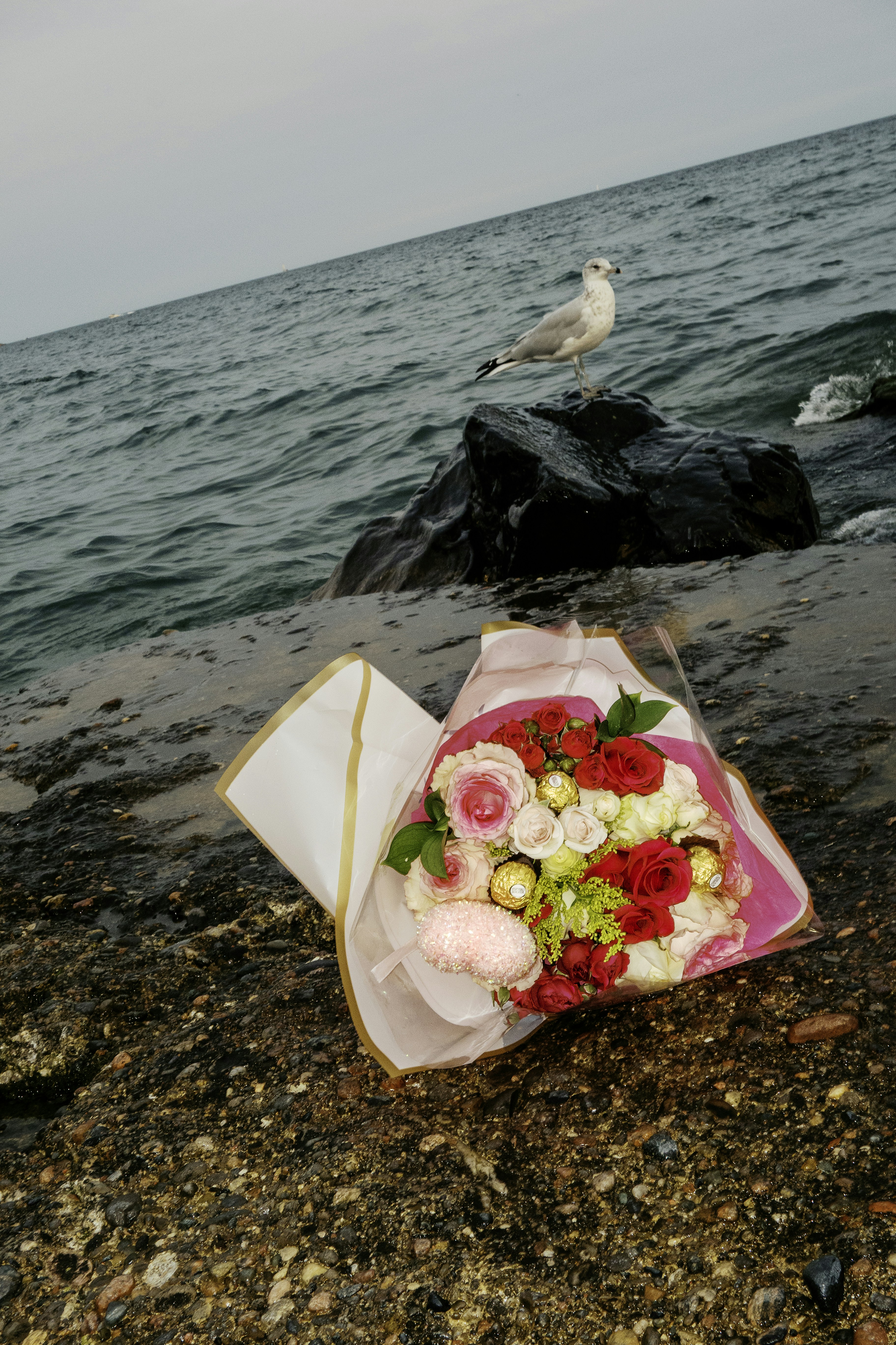 Bouquet on the Shore: Colorful Florals Meet Rocky Seascape
