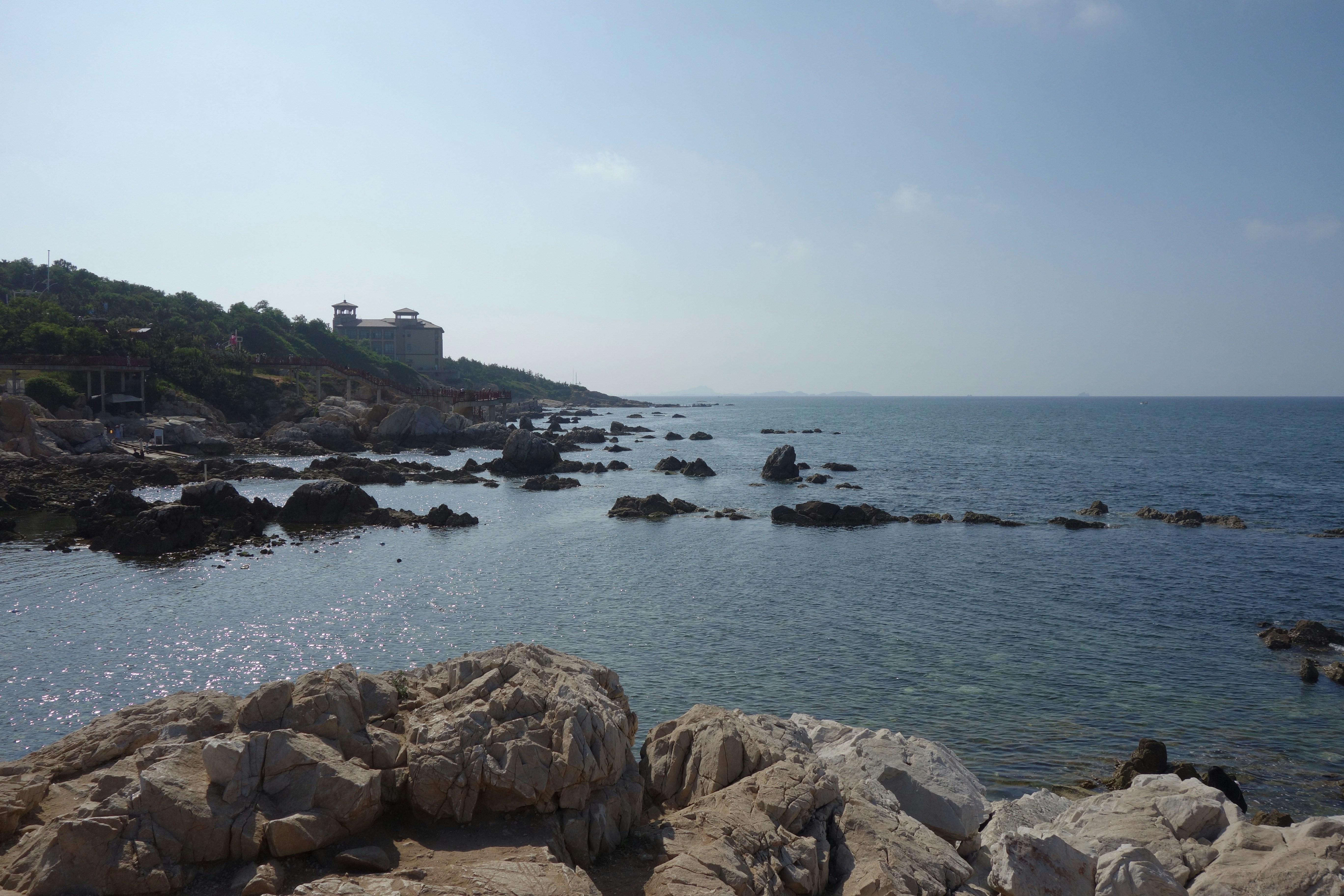 Rocky shoreline beneath a quiet horizon