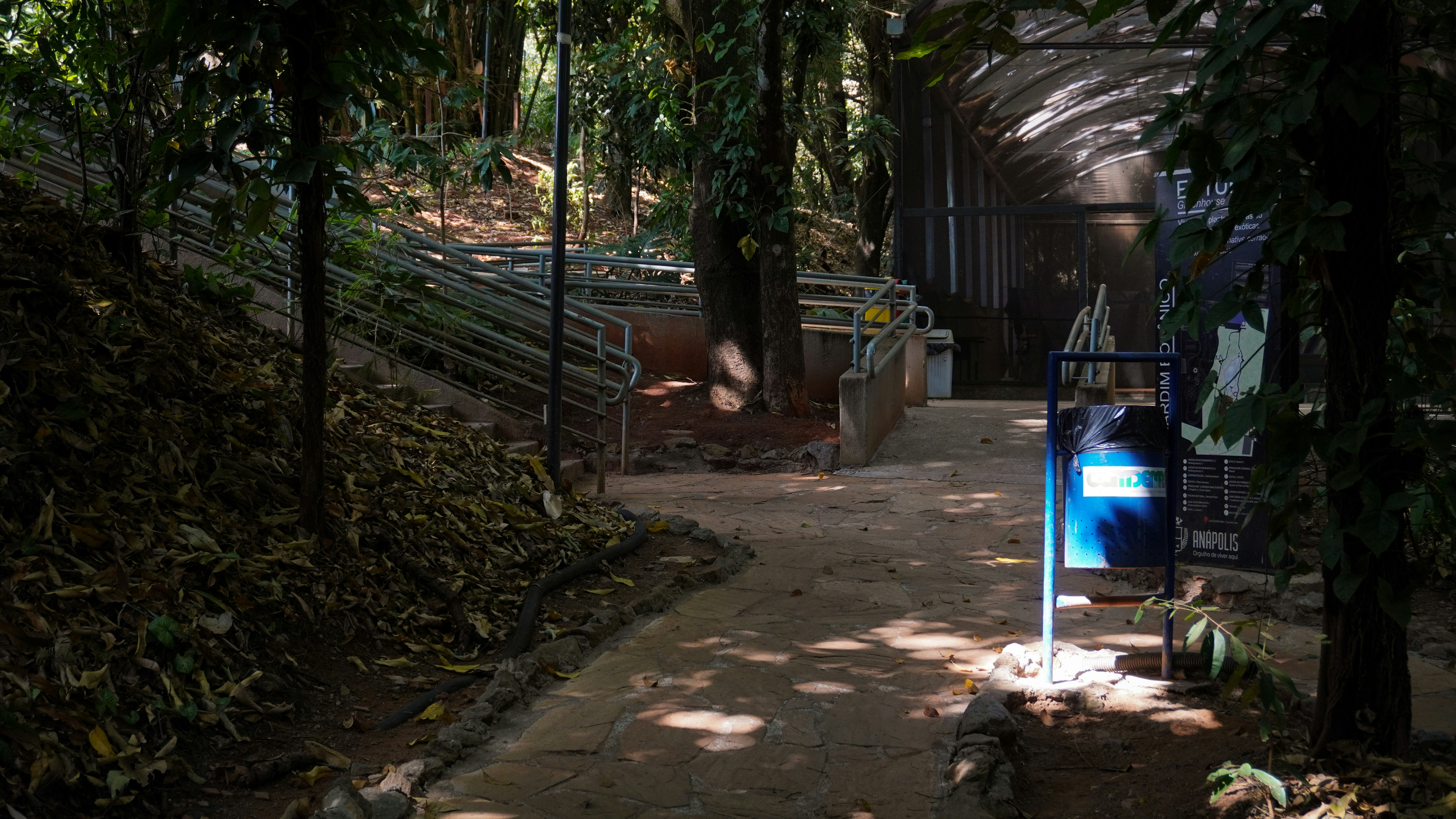 Shadowed Path to the Doorway: A Quiet Corridor in the Park
