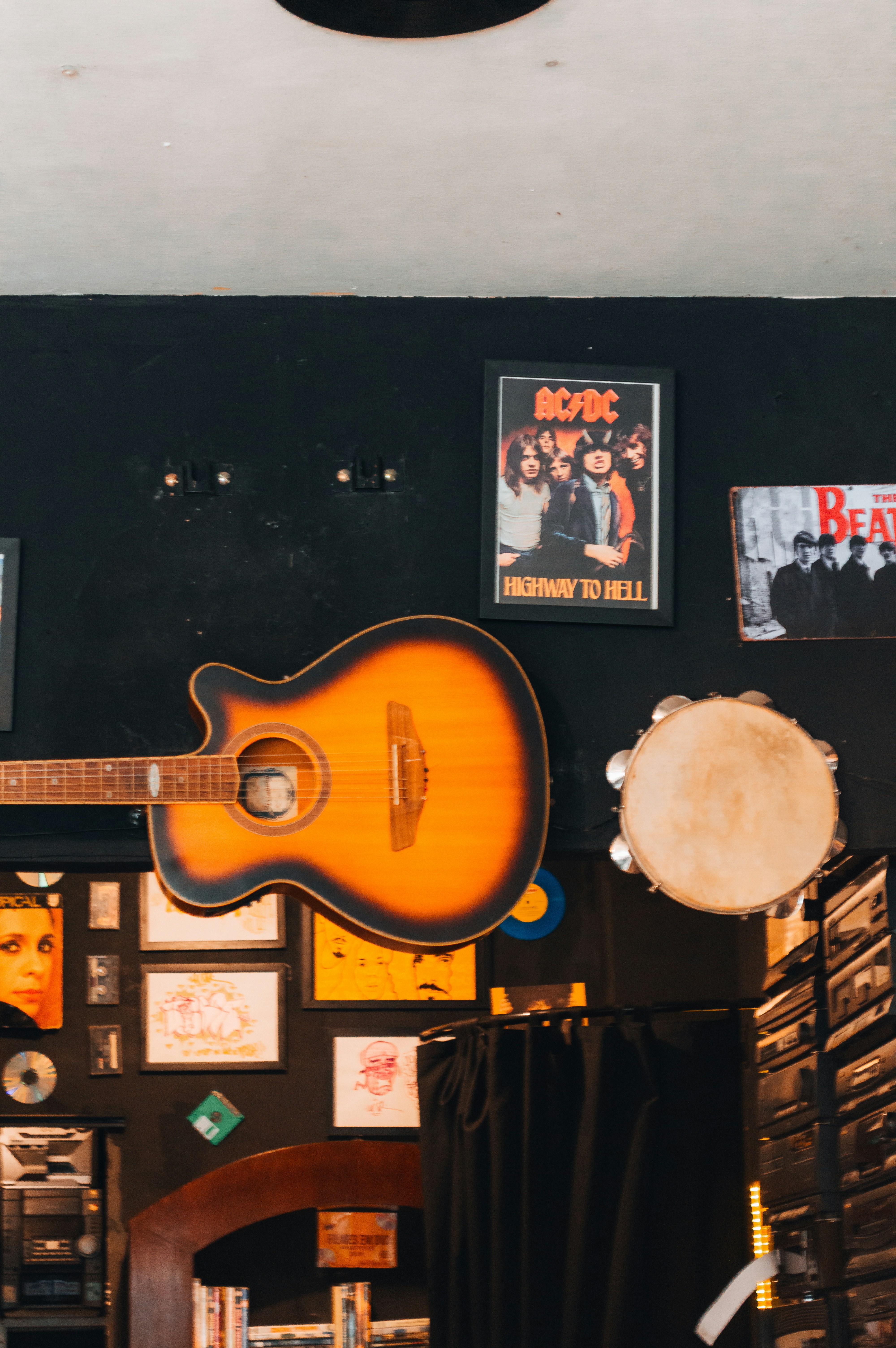 Guitarist’s Corner: A Sunburst Acoustic Hung in a Music-Lounge World