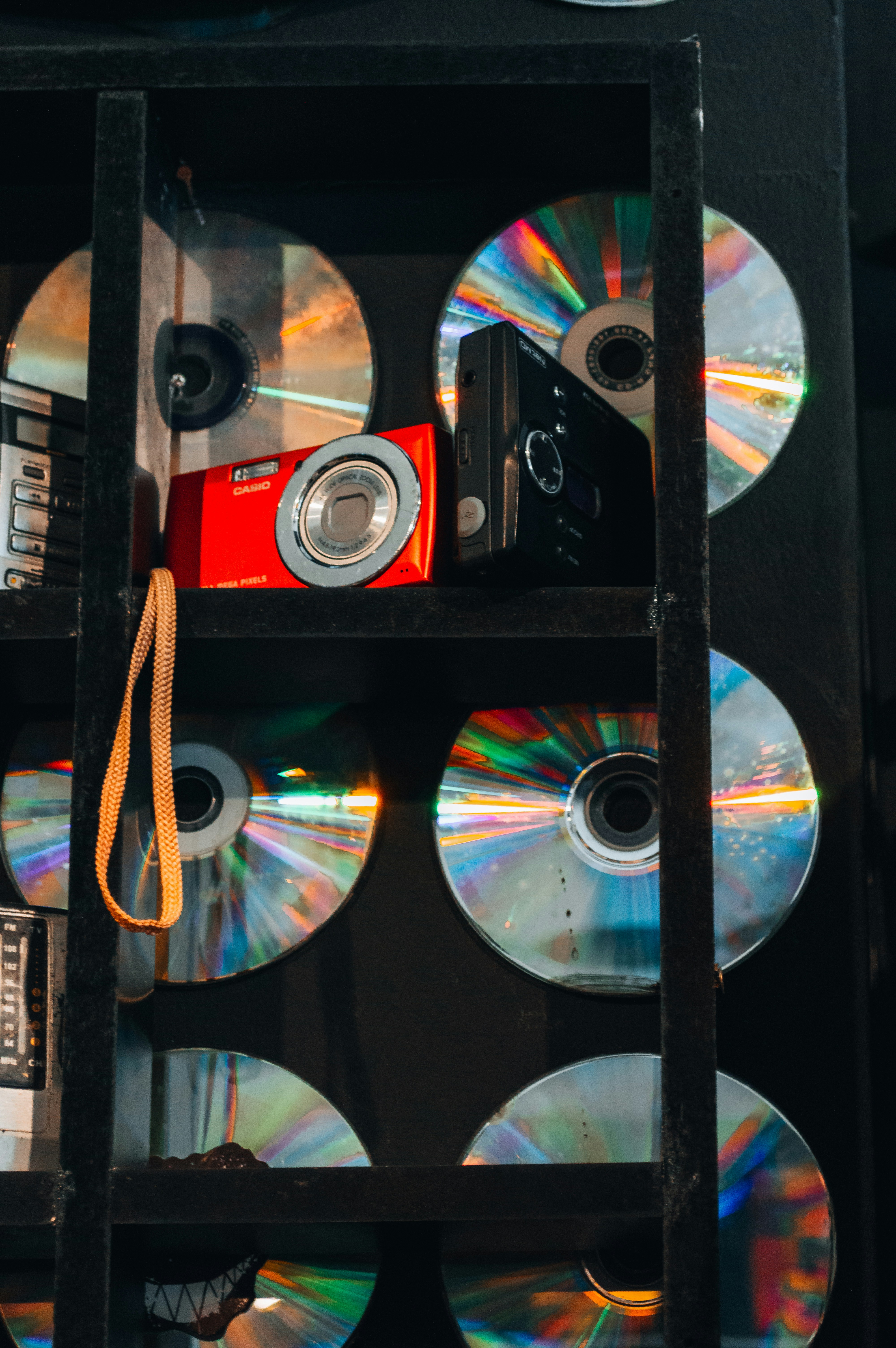 Retro Red Compact and CDs in a Black Rack