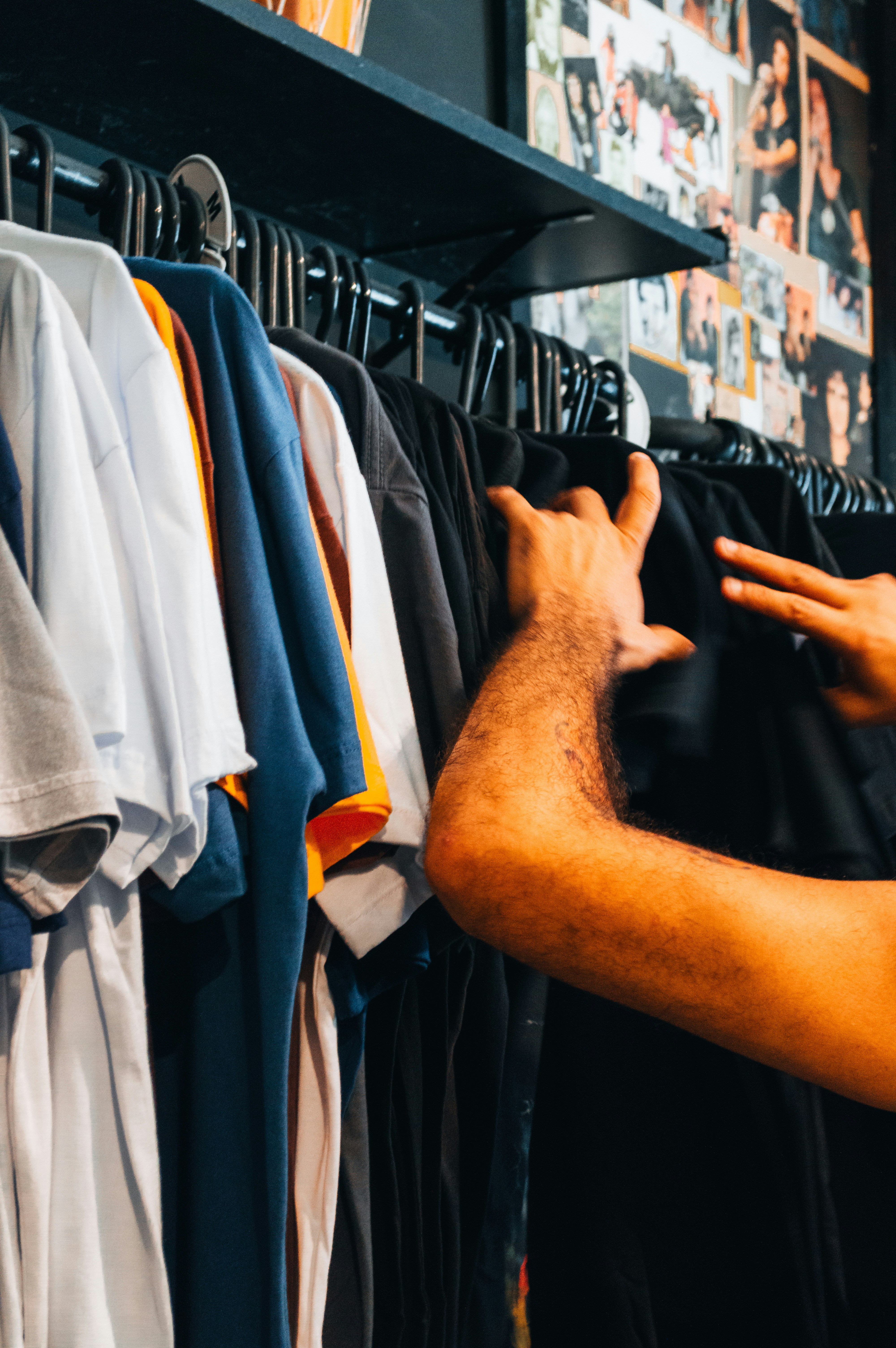 Hands on the Rack: A Shopkeeper’s Grasp at the Garments