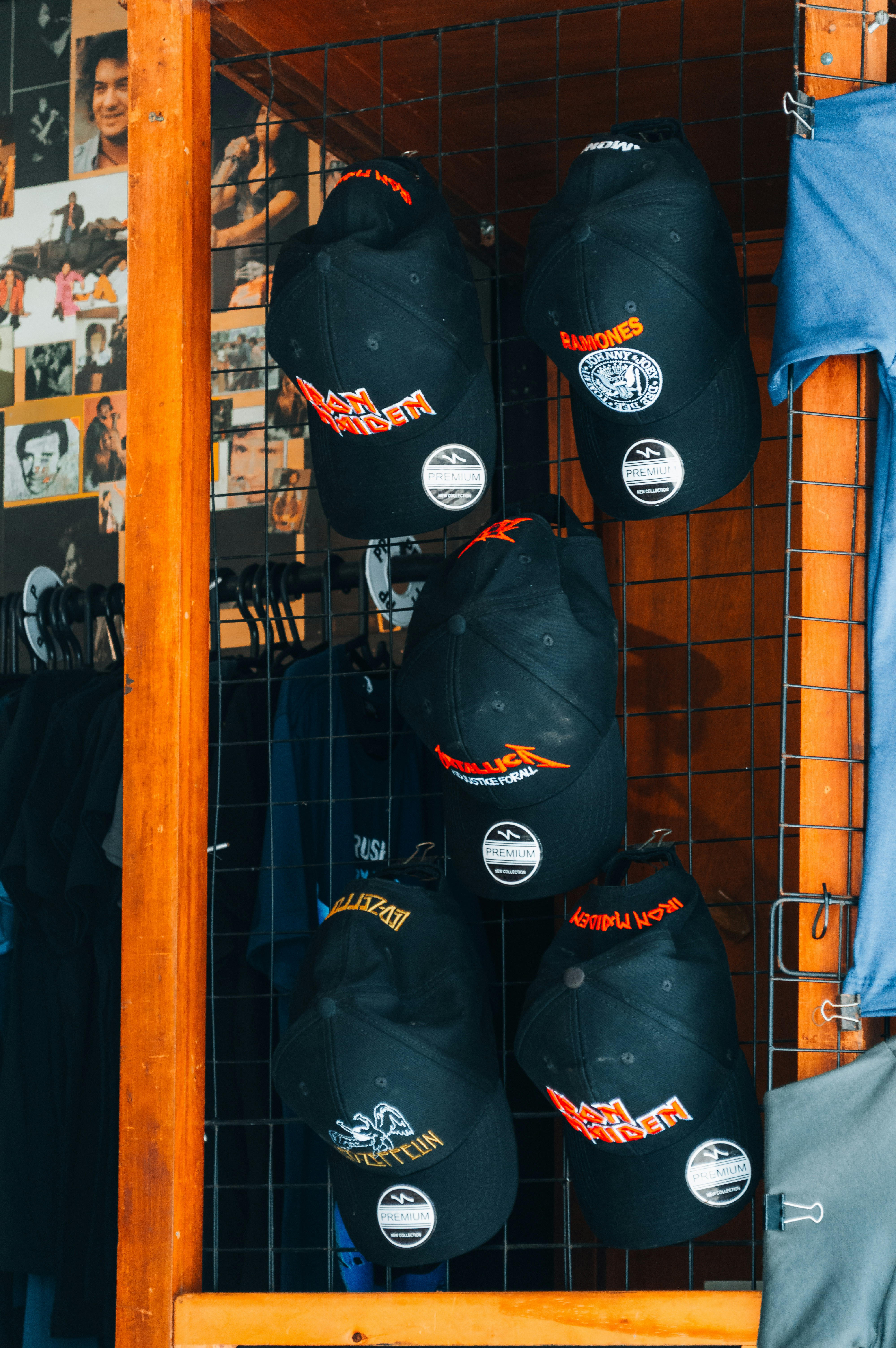 Caps and Cables: A Tight Display of Hat Staples on a Wooden Shelf