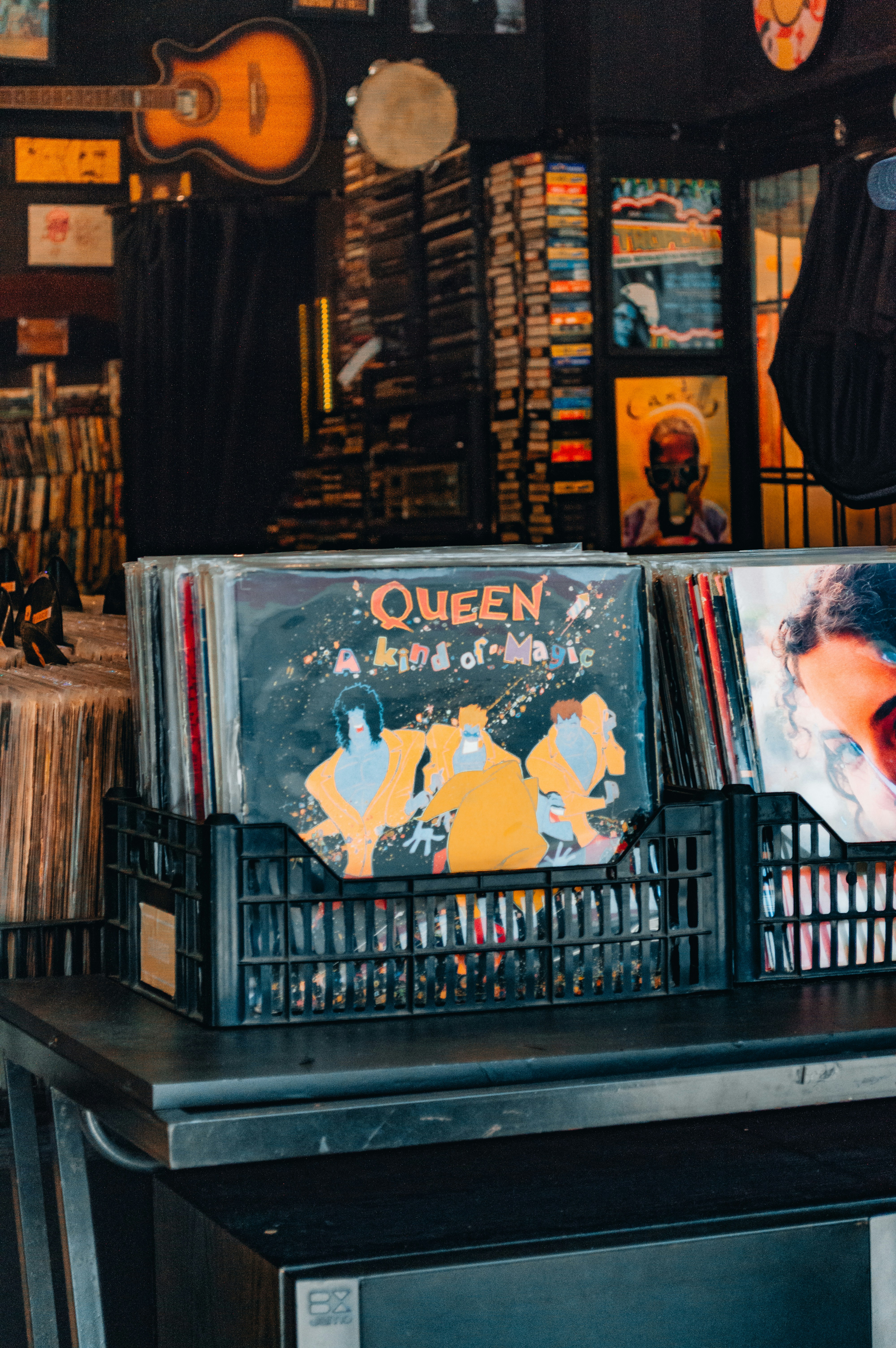 Queen vinyl in a cozy record shop glow
