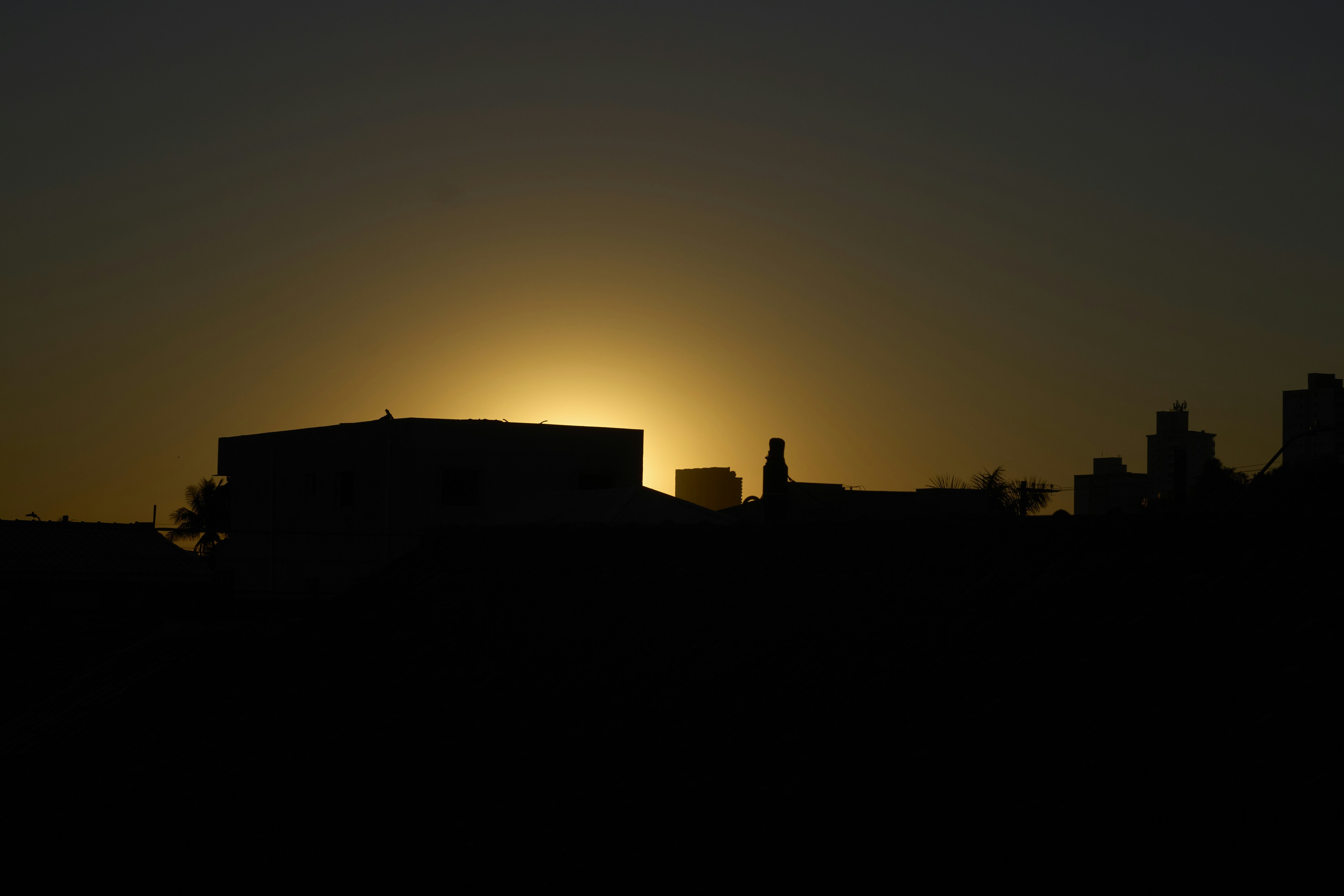 Sunrise Behind a Quiet City Silhouette
