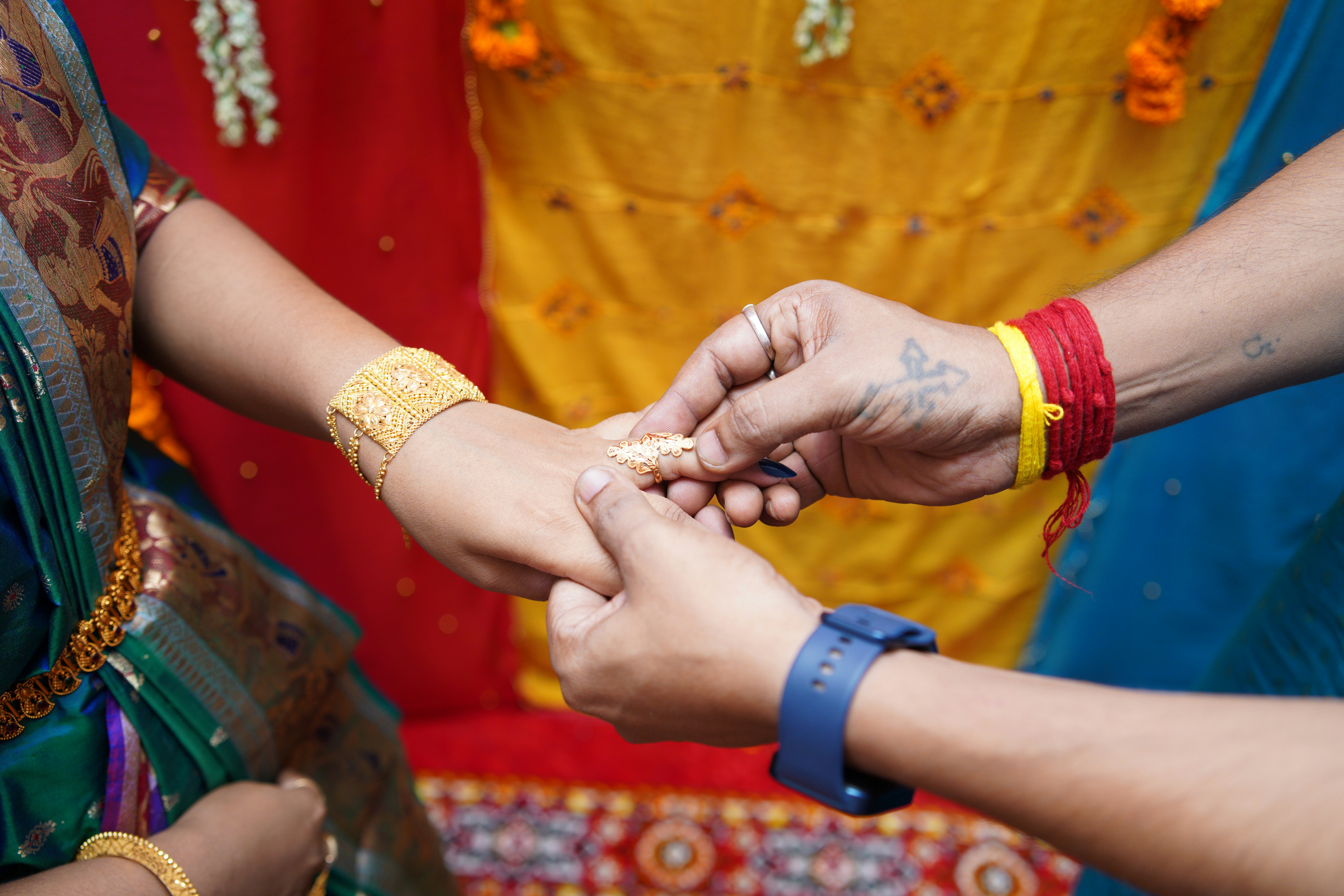 Unfolding Ritual: A Handoff at a Vibrant Indian Ceremony