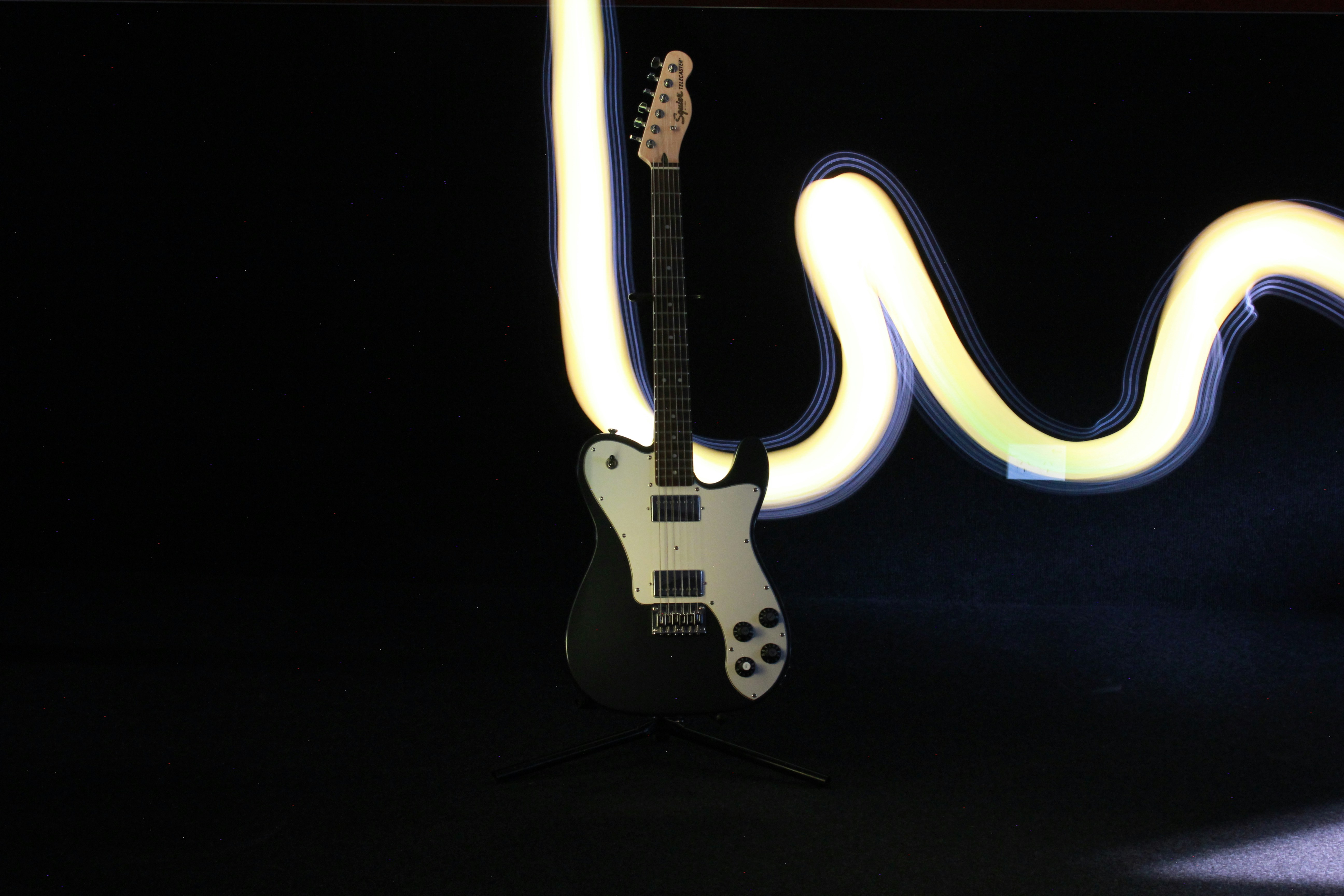 Midnight Telecaster in a Neon Sinuous Light