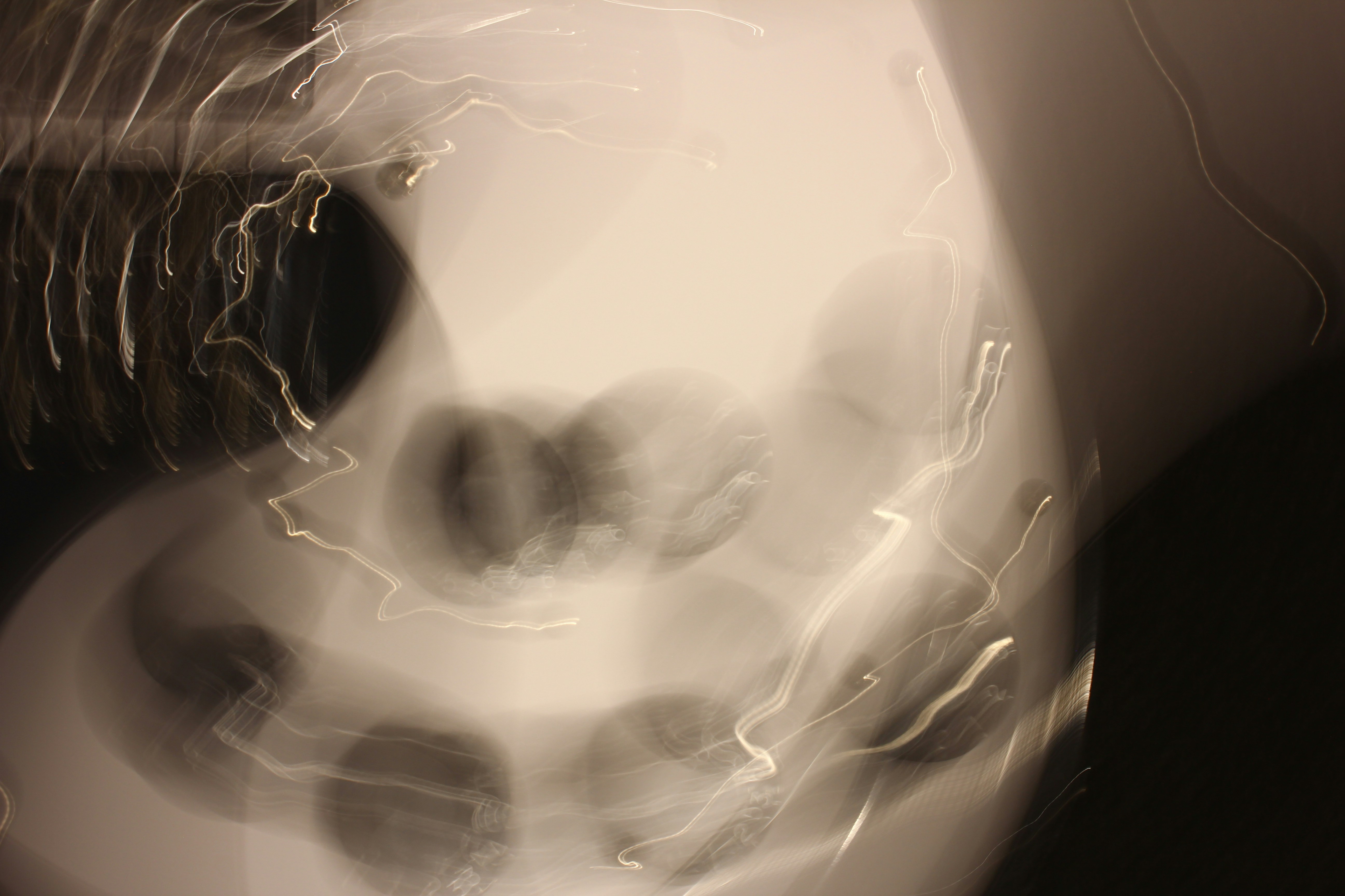 Blurred Light Rings Over a White Surface