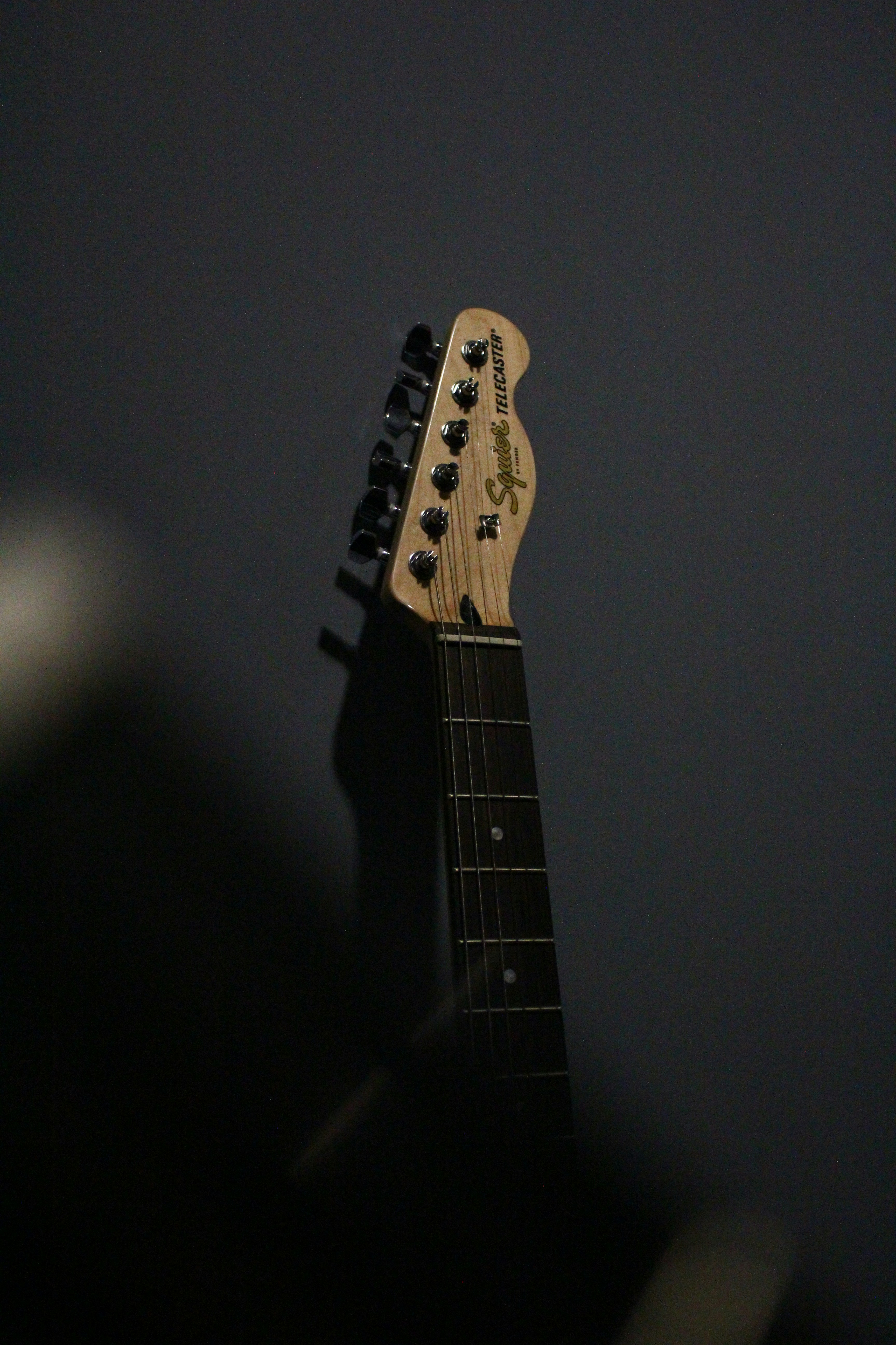 Emerald Headstock in Dim Studio Glow