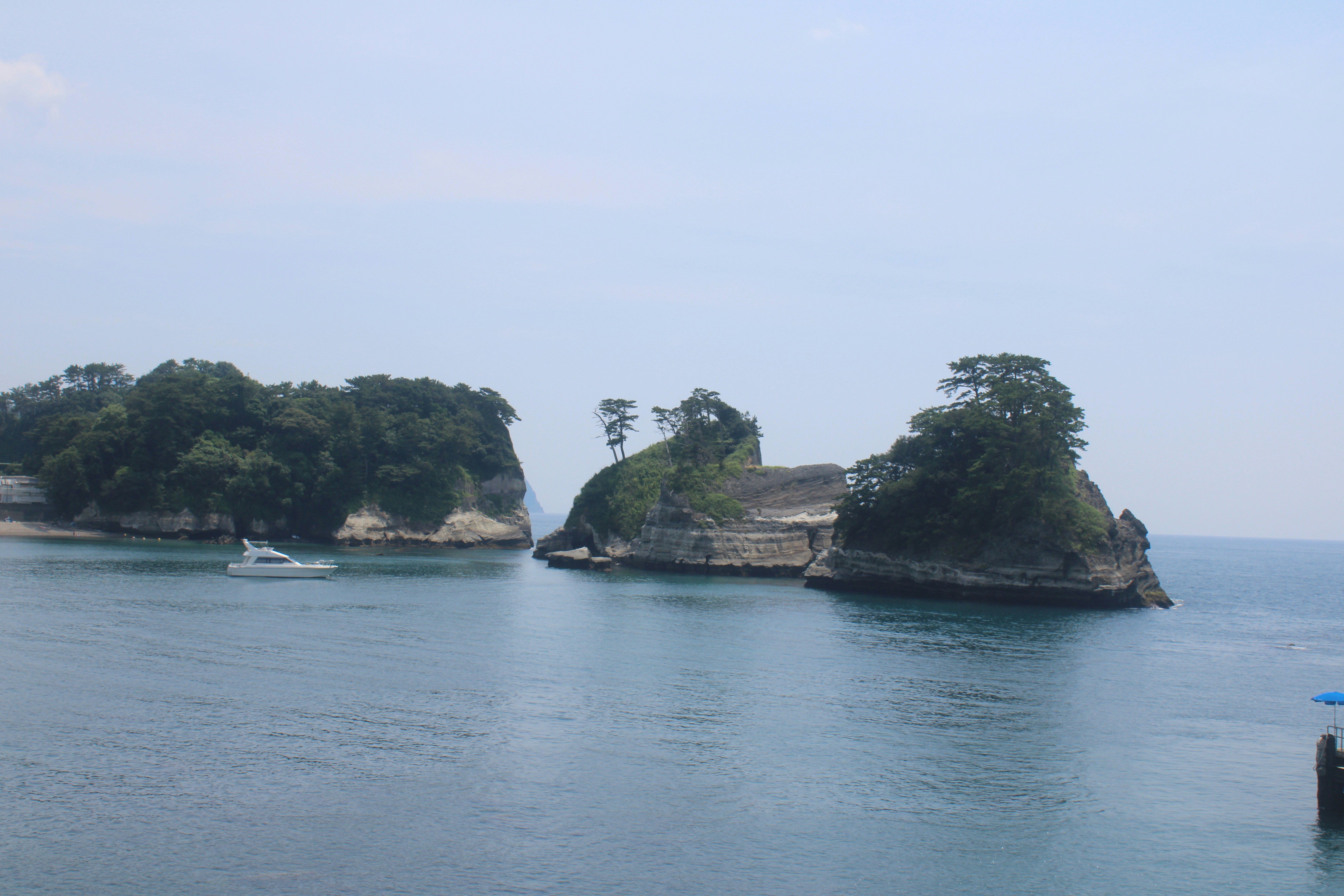 Isolated Rock-Jagged Islands on a Calm Sea