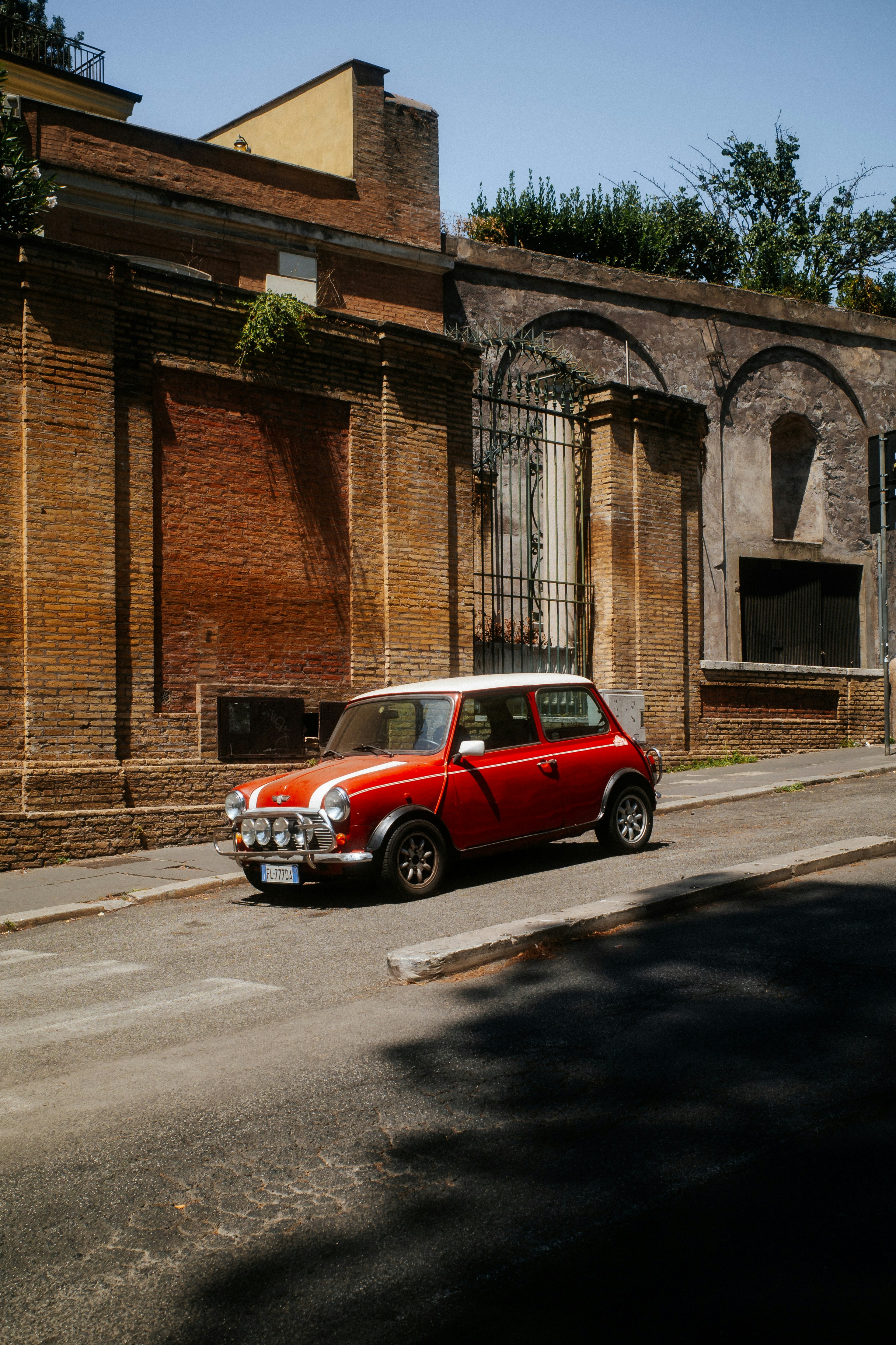 Red Classic on a Quiet Brick Street