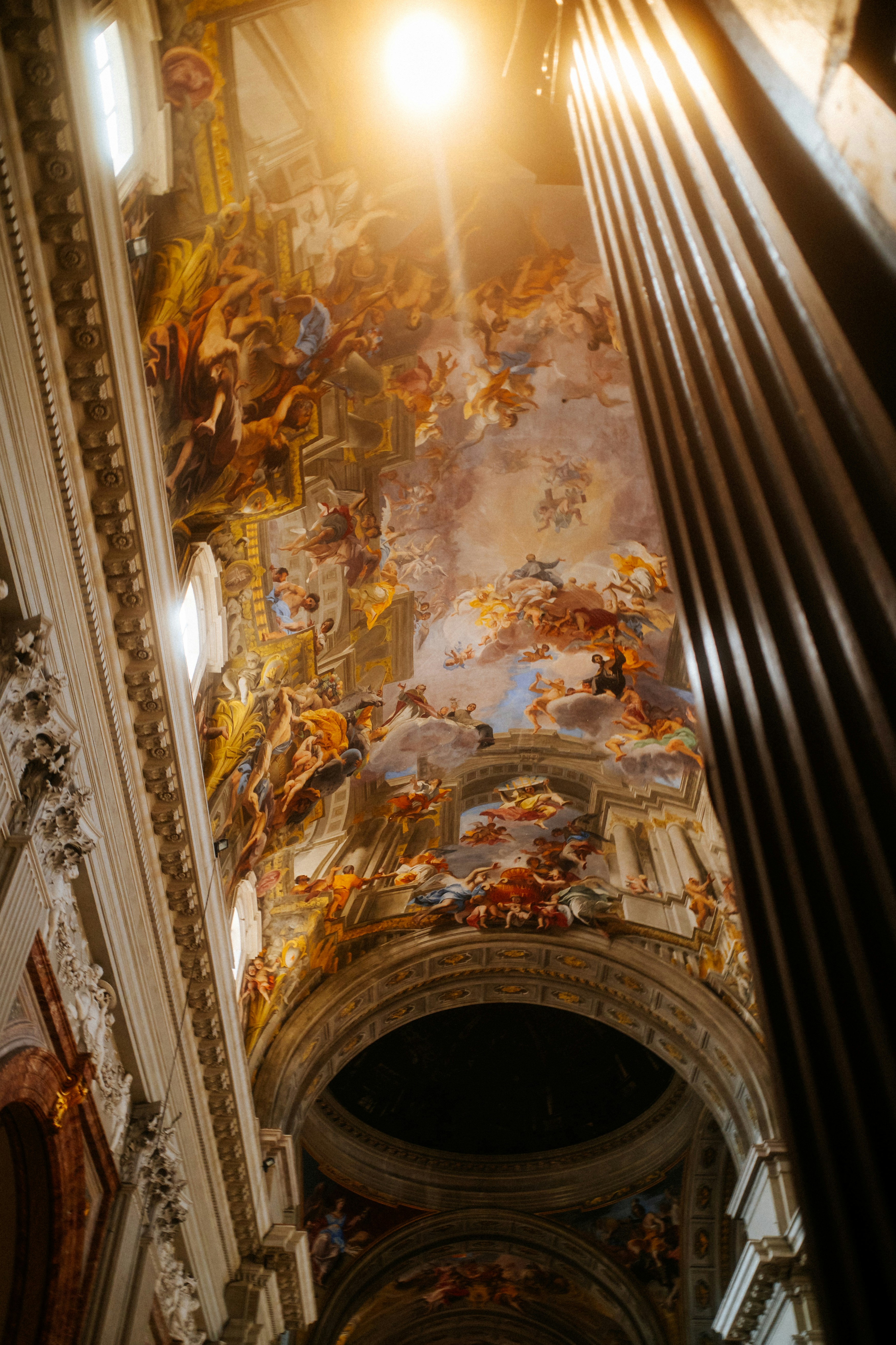 Heavenly frescoes and ornate arches bathed in warm light