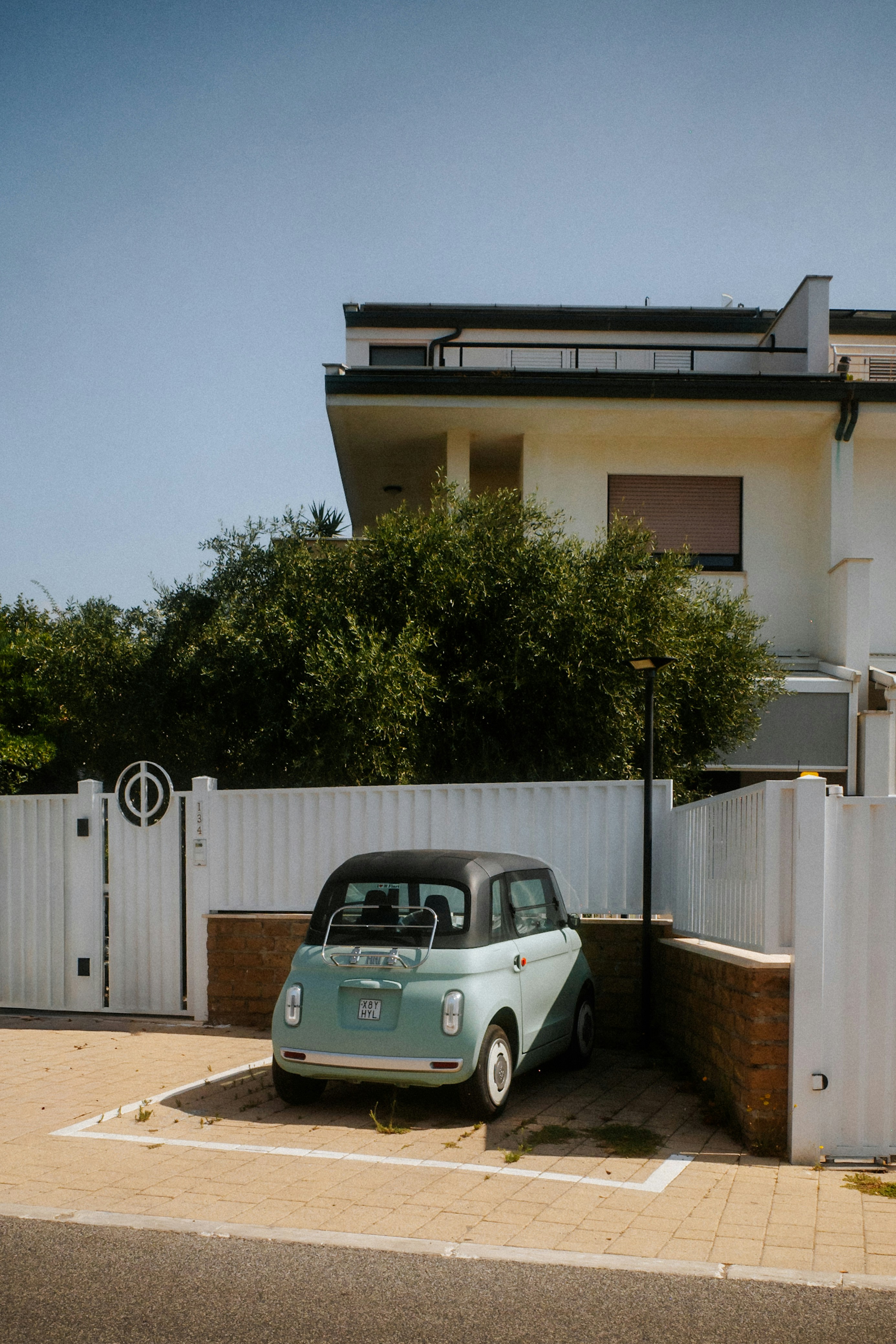 Minted Memories: A Mint-green Classic in a Quiet Driveway
