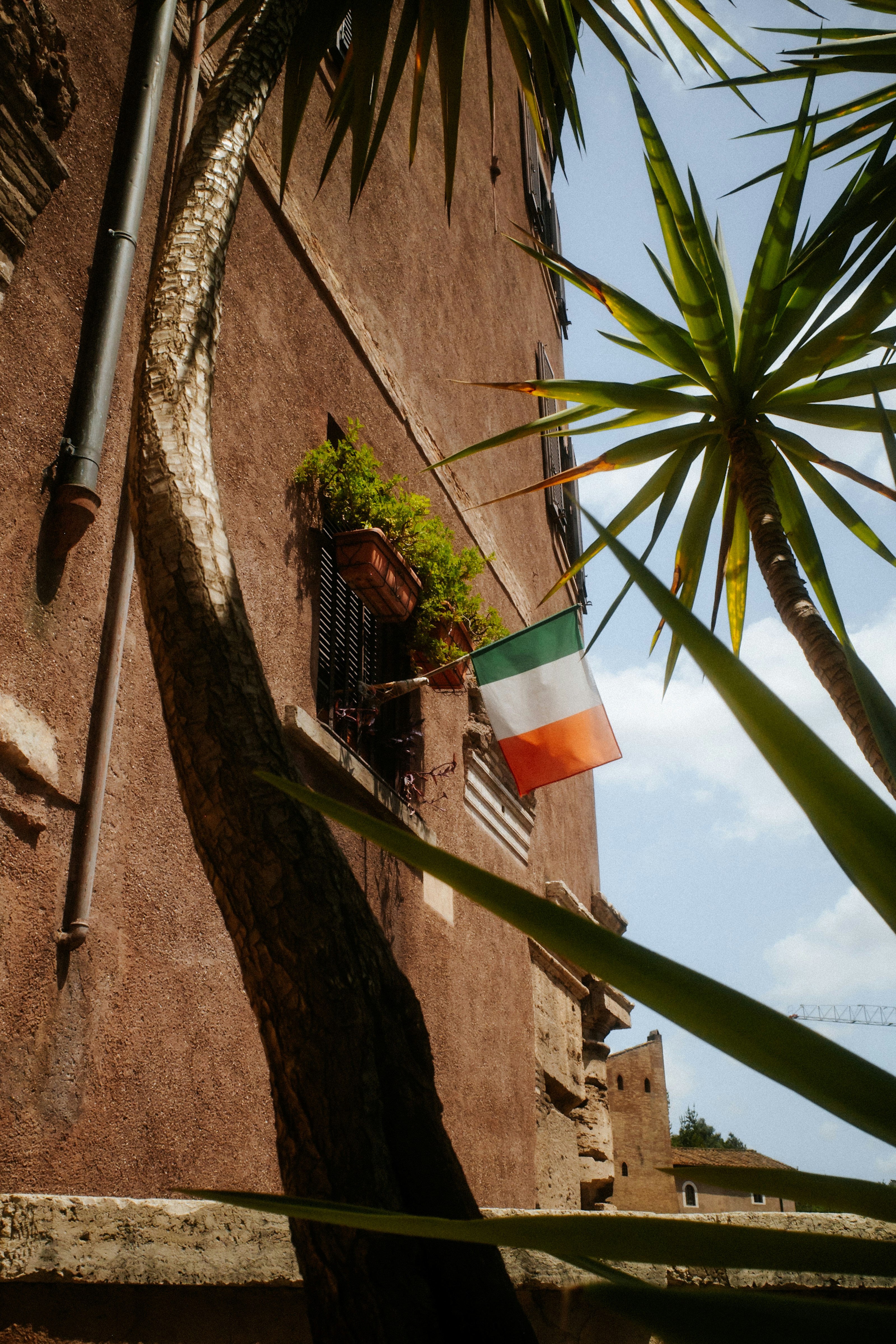 Italian Flag Drifting in the Courtyard Sunlight