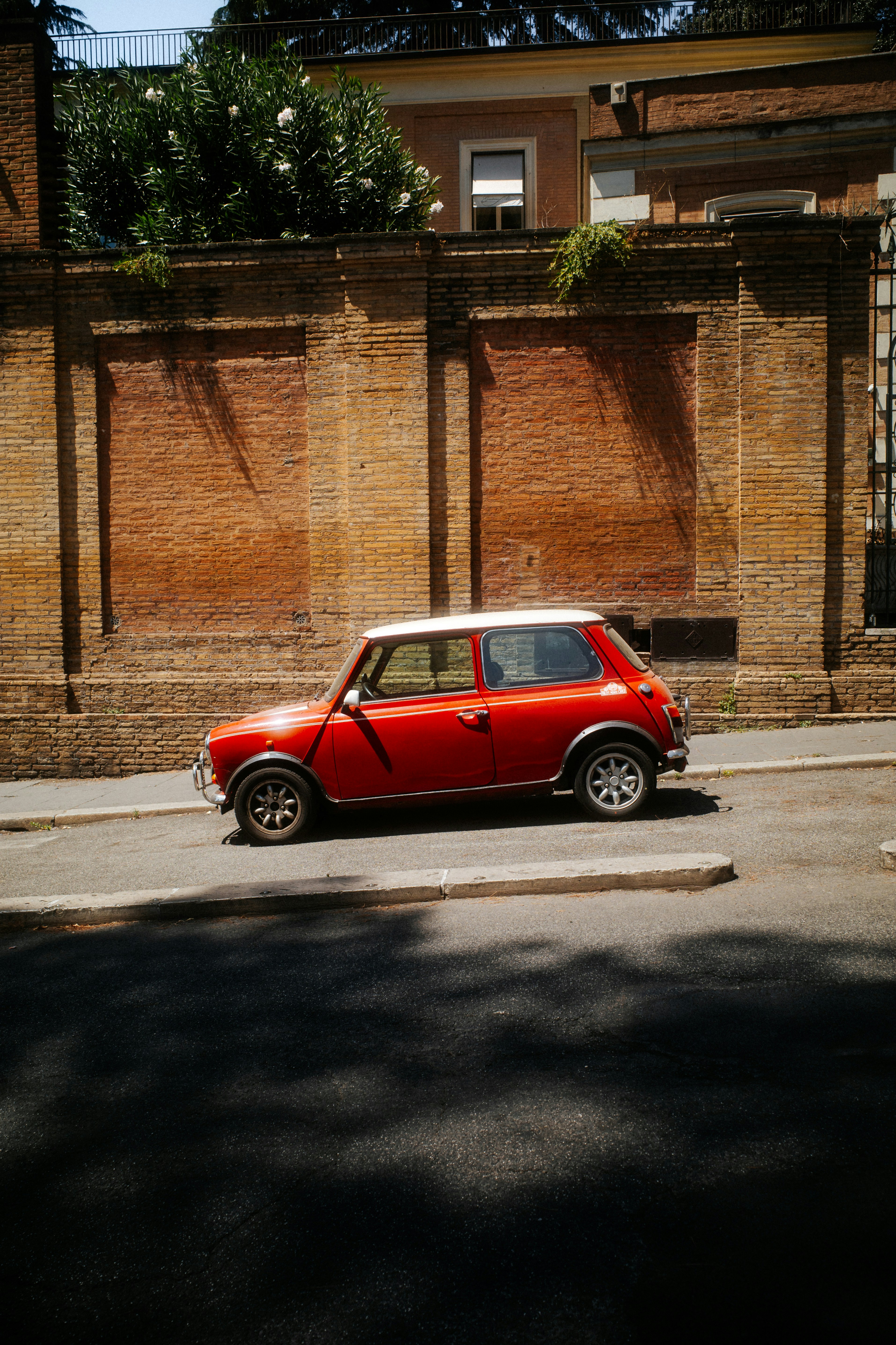Red Classic on a Narrow Italian Street
