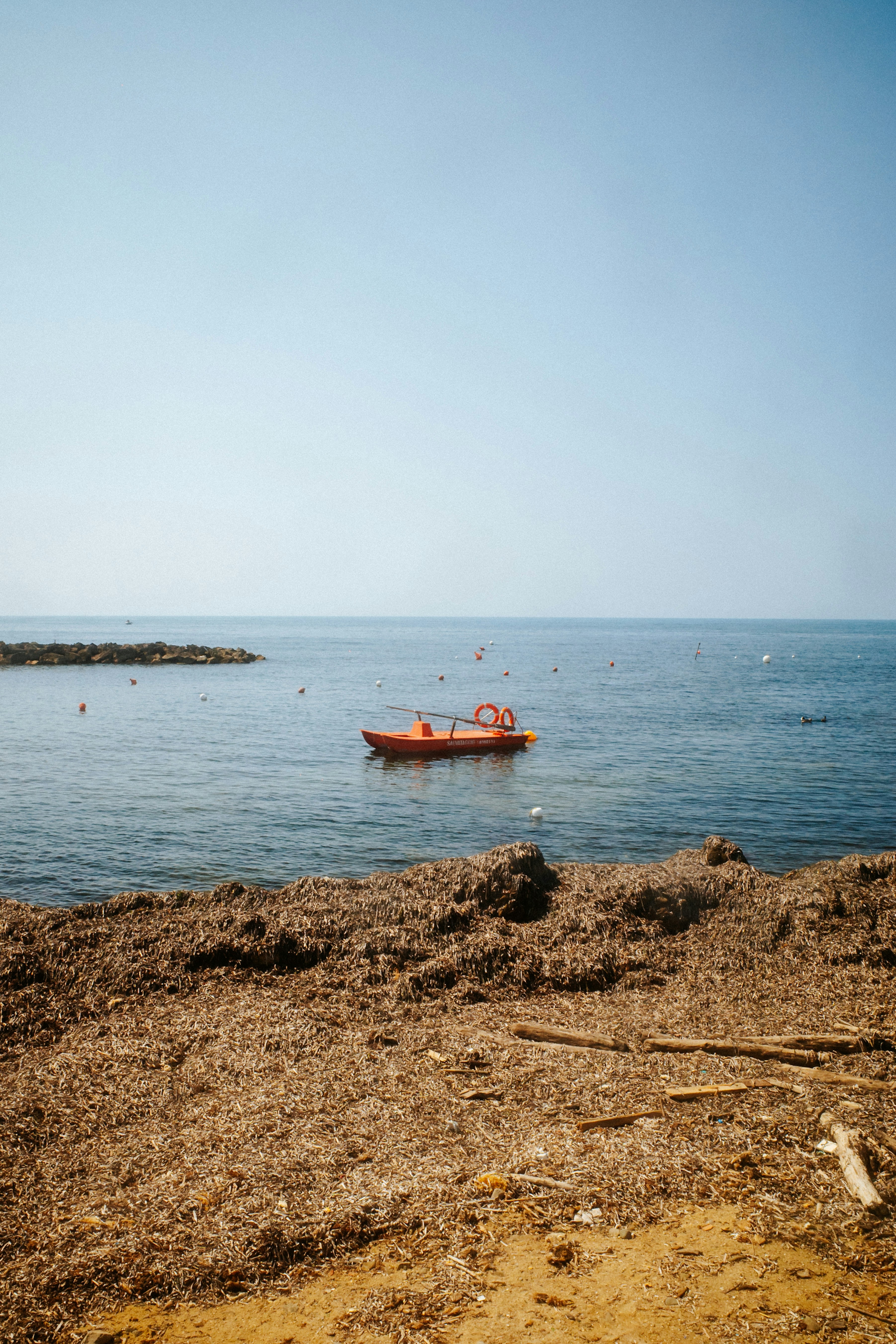 Red Life Ring Over Calm Mediterranean Wake