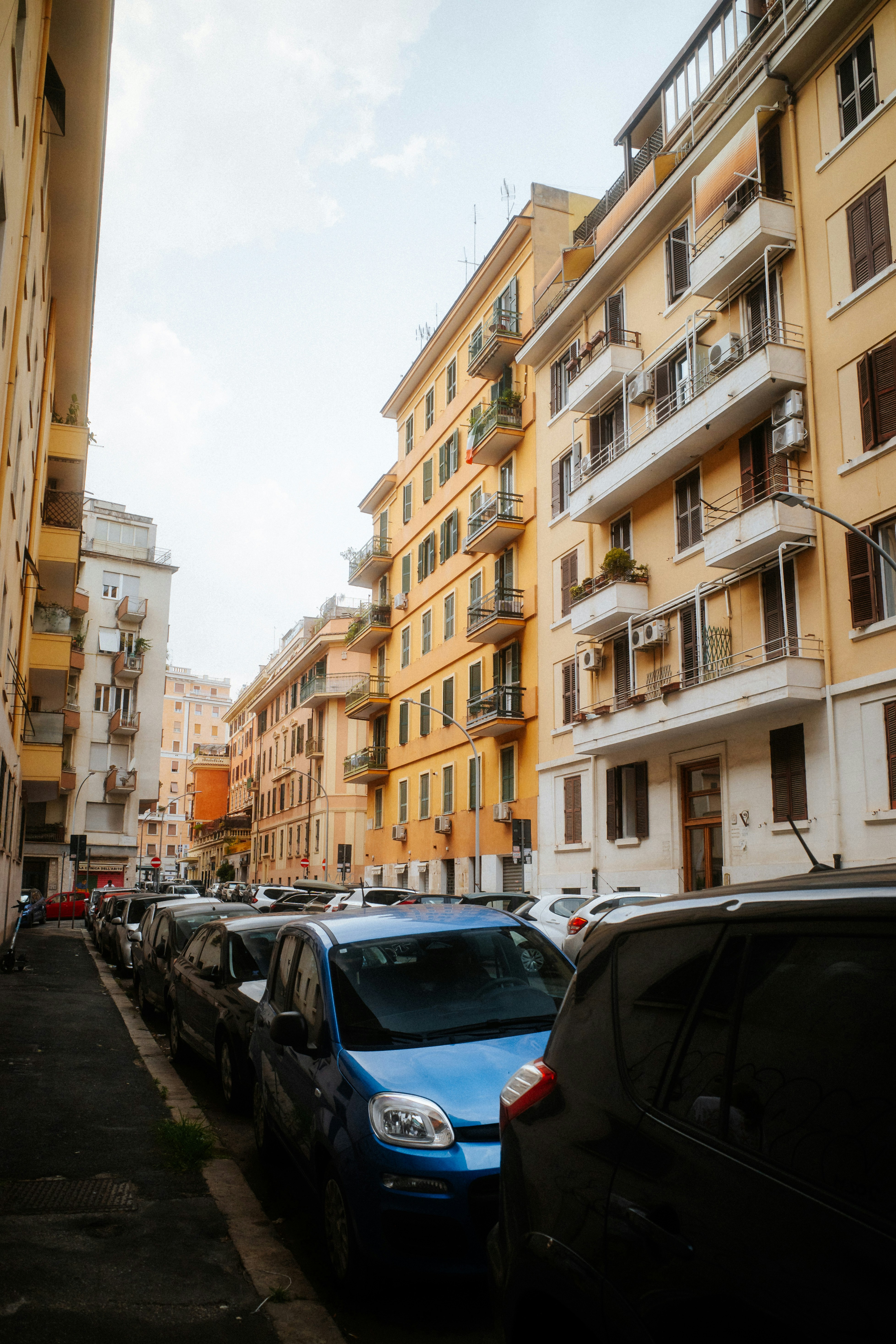 Urban Canyon: Sunlit Facades and Sidelined Street in a European Block
