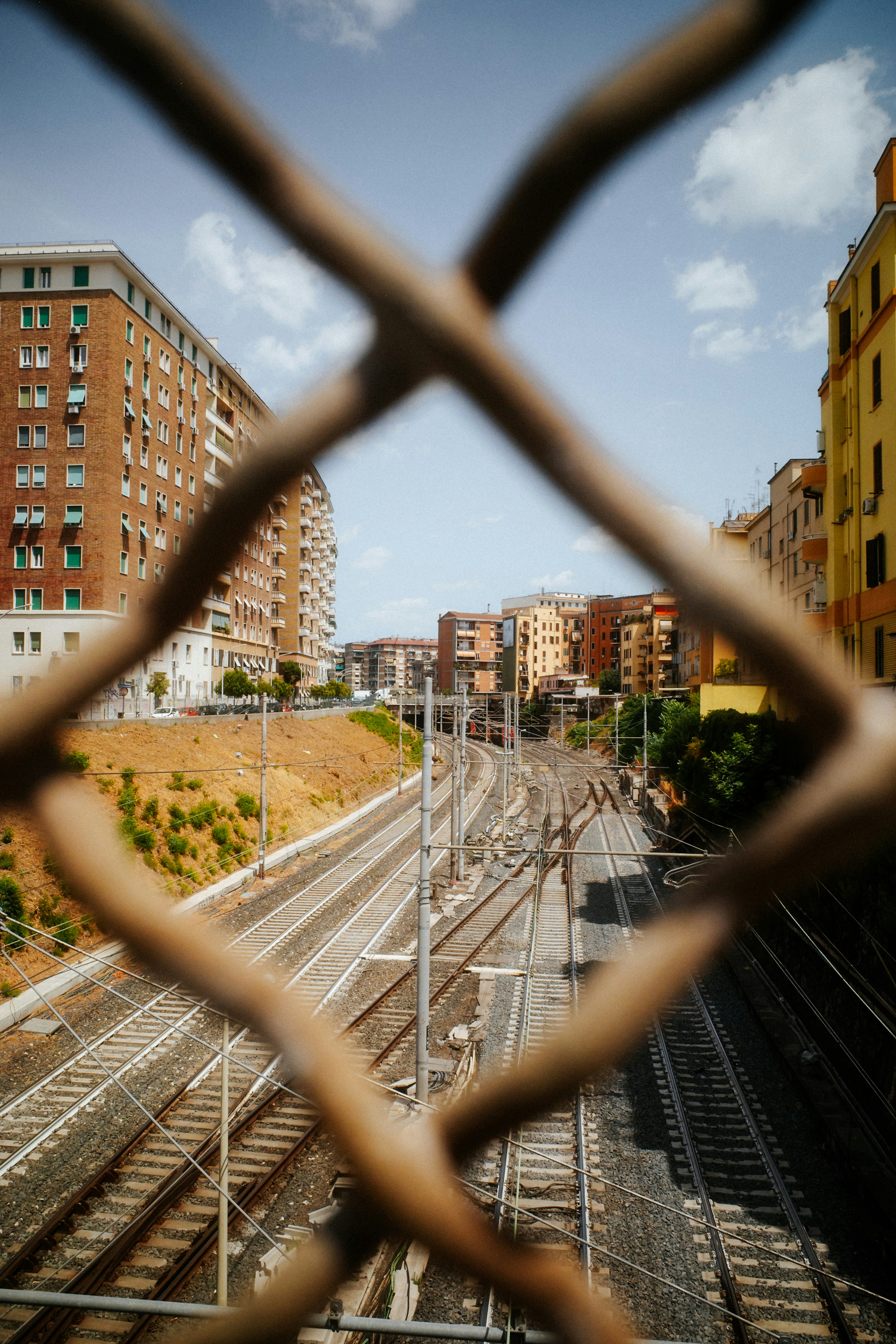 Crossed Lattice: City Rails Sliced by a Fenced Moment