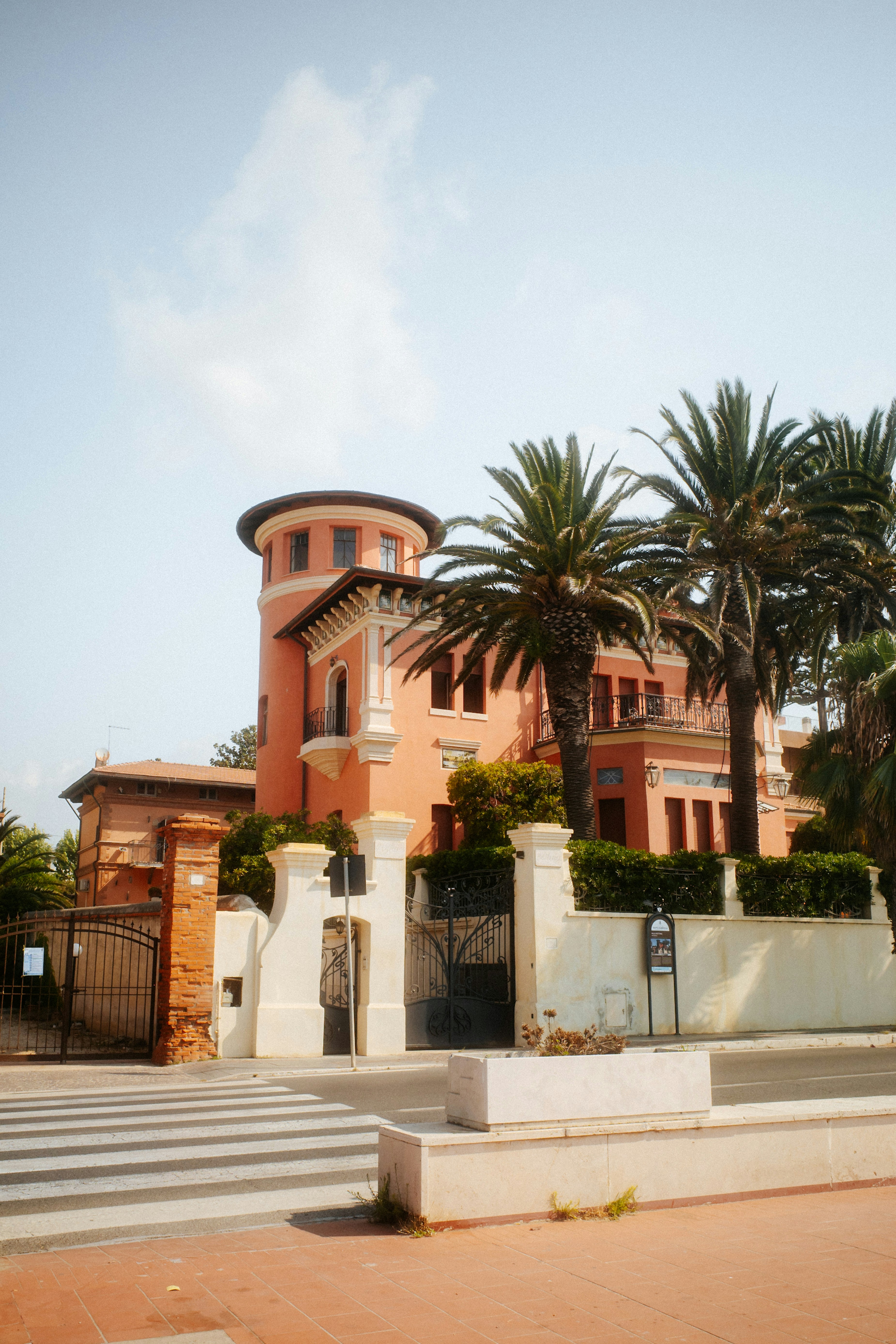 Orange Villa Under Palm Canopy