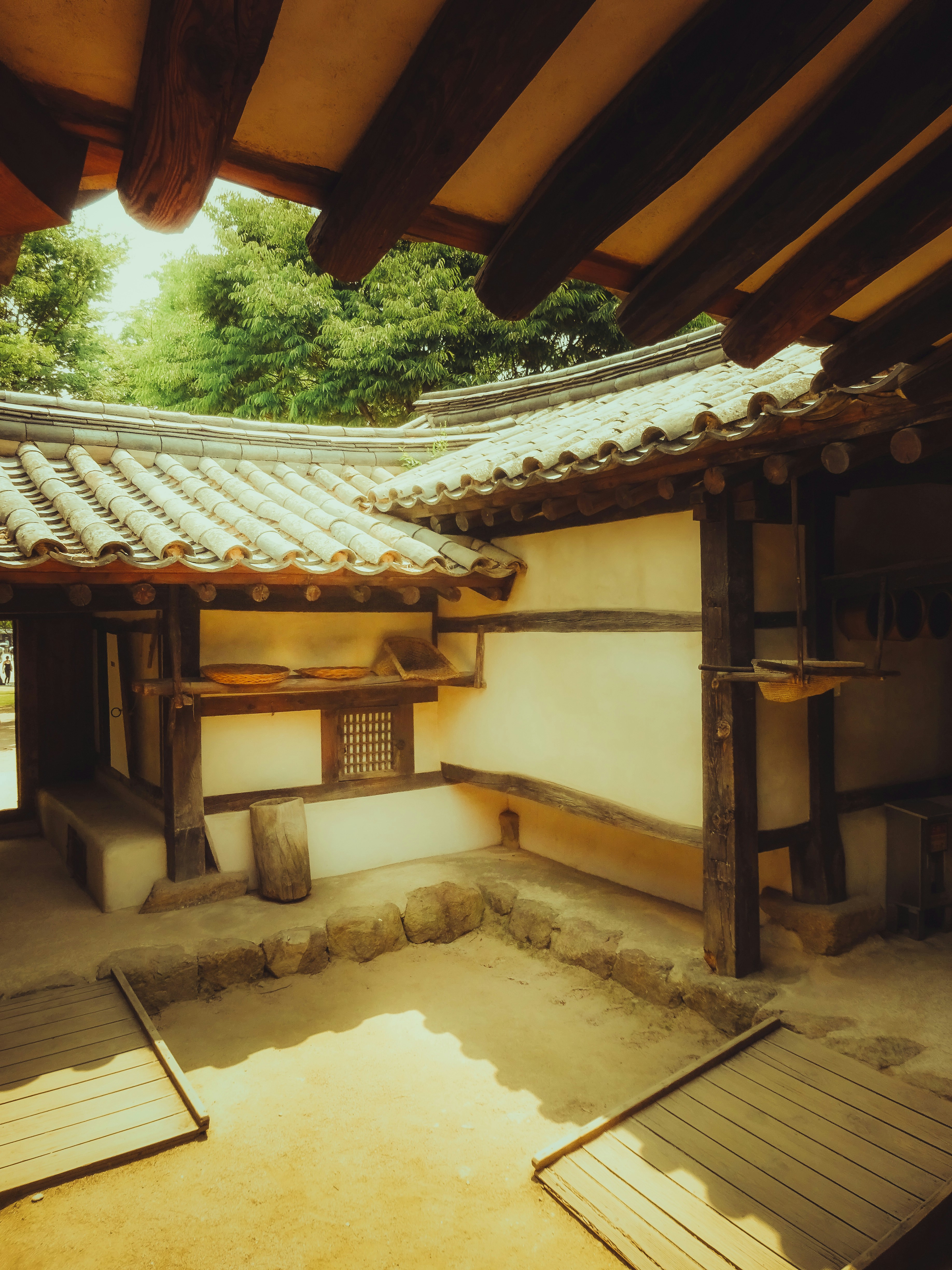 Courtyard Echoes: Sunlit Layers of Traditional Walling and Roofs