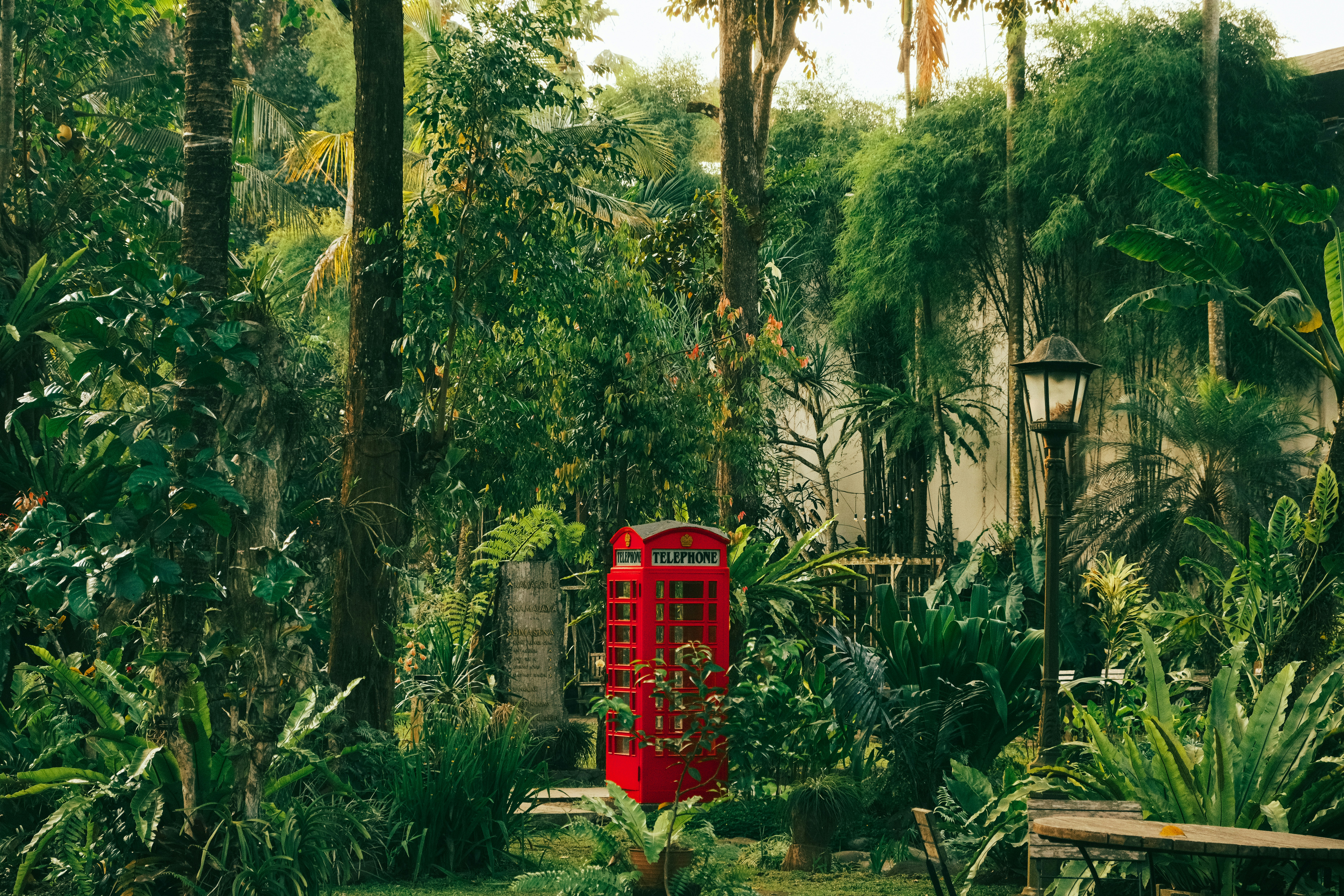 Red Kiosk in a Lush Green Retreat