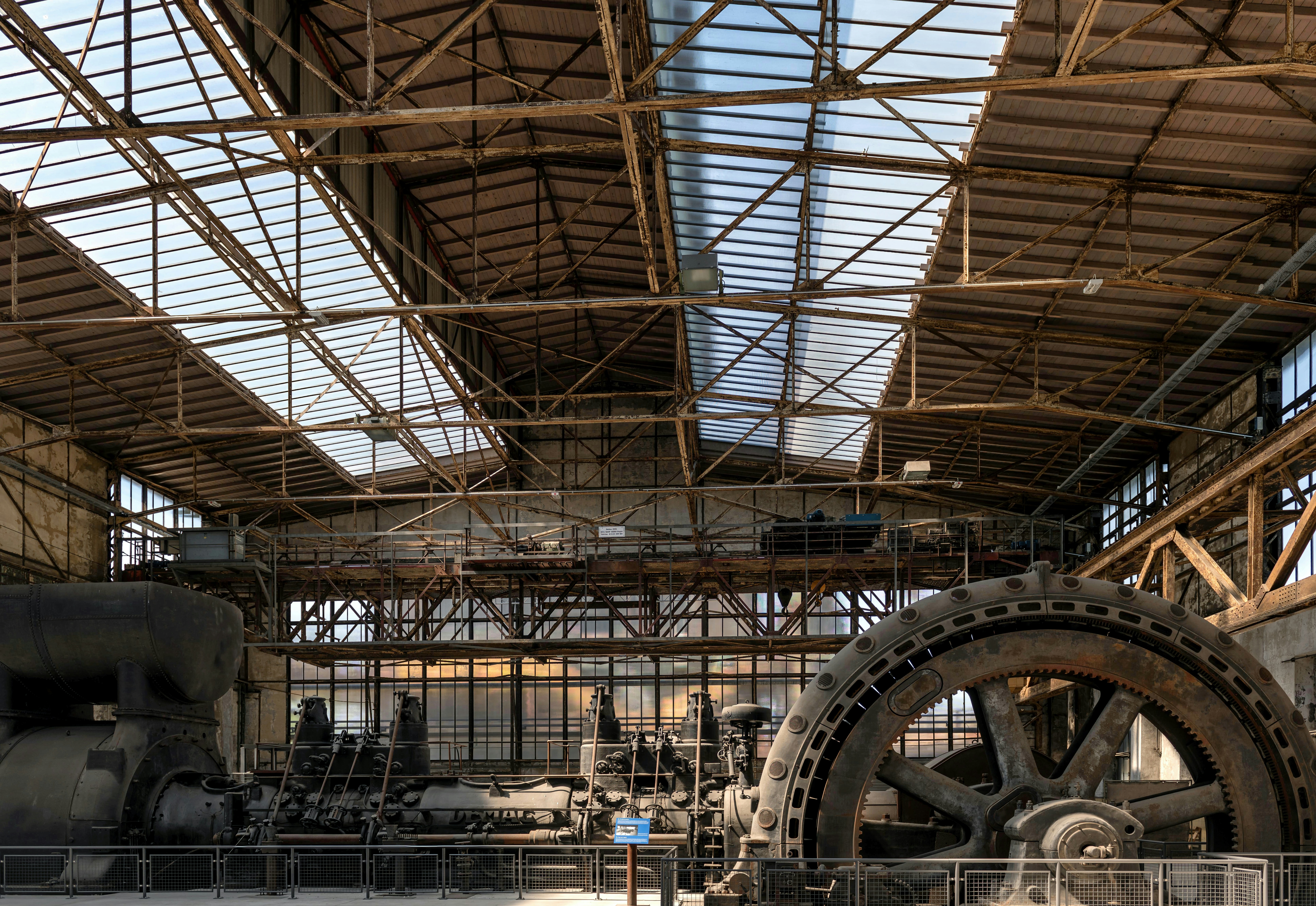 Rusted Machinery in a Sunlit Industrial Hall