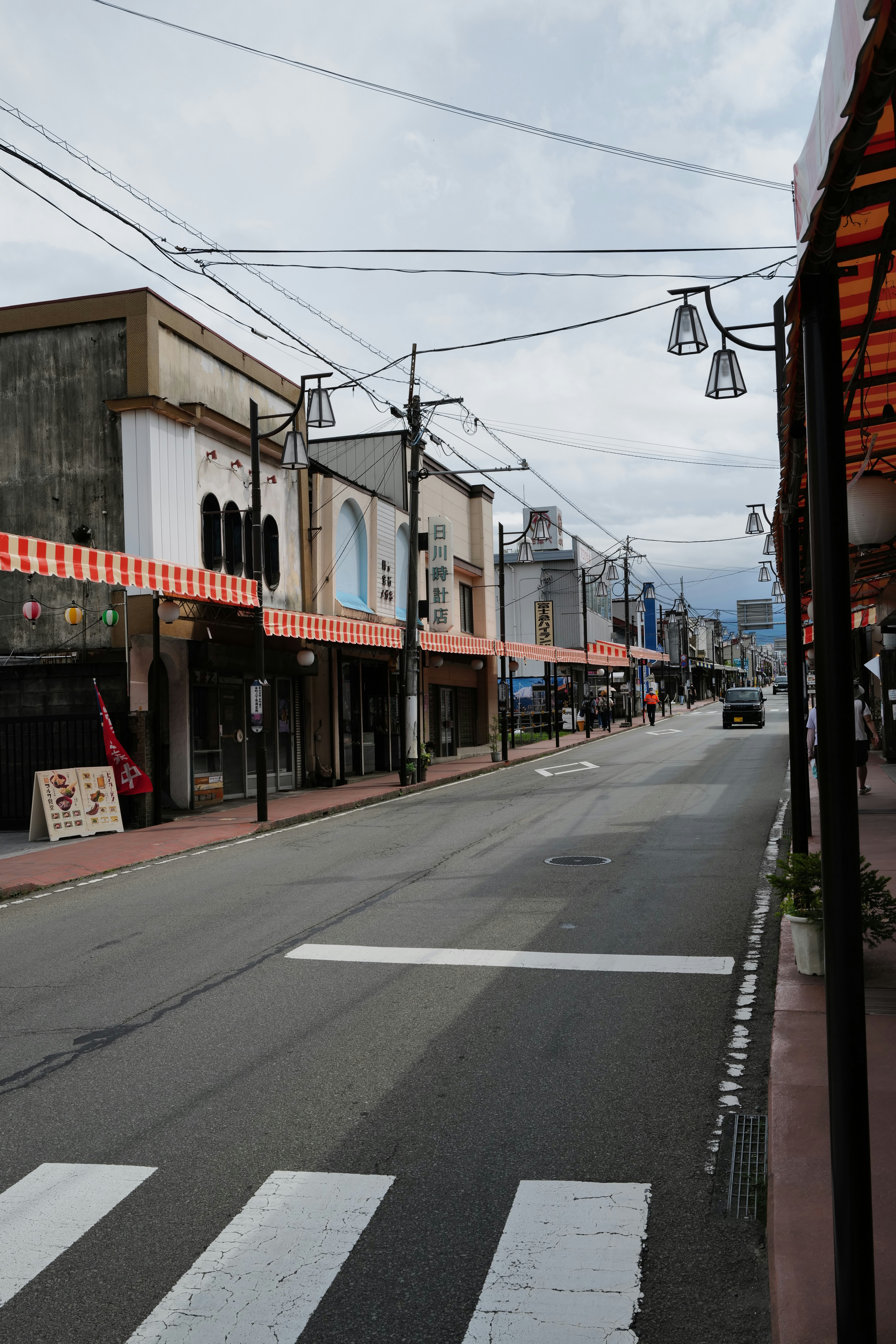 A Quiet Main Street Under Strung Wires