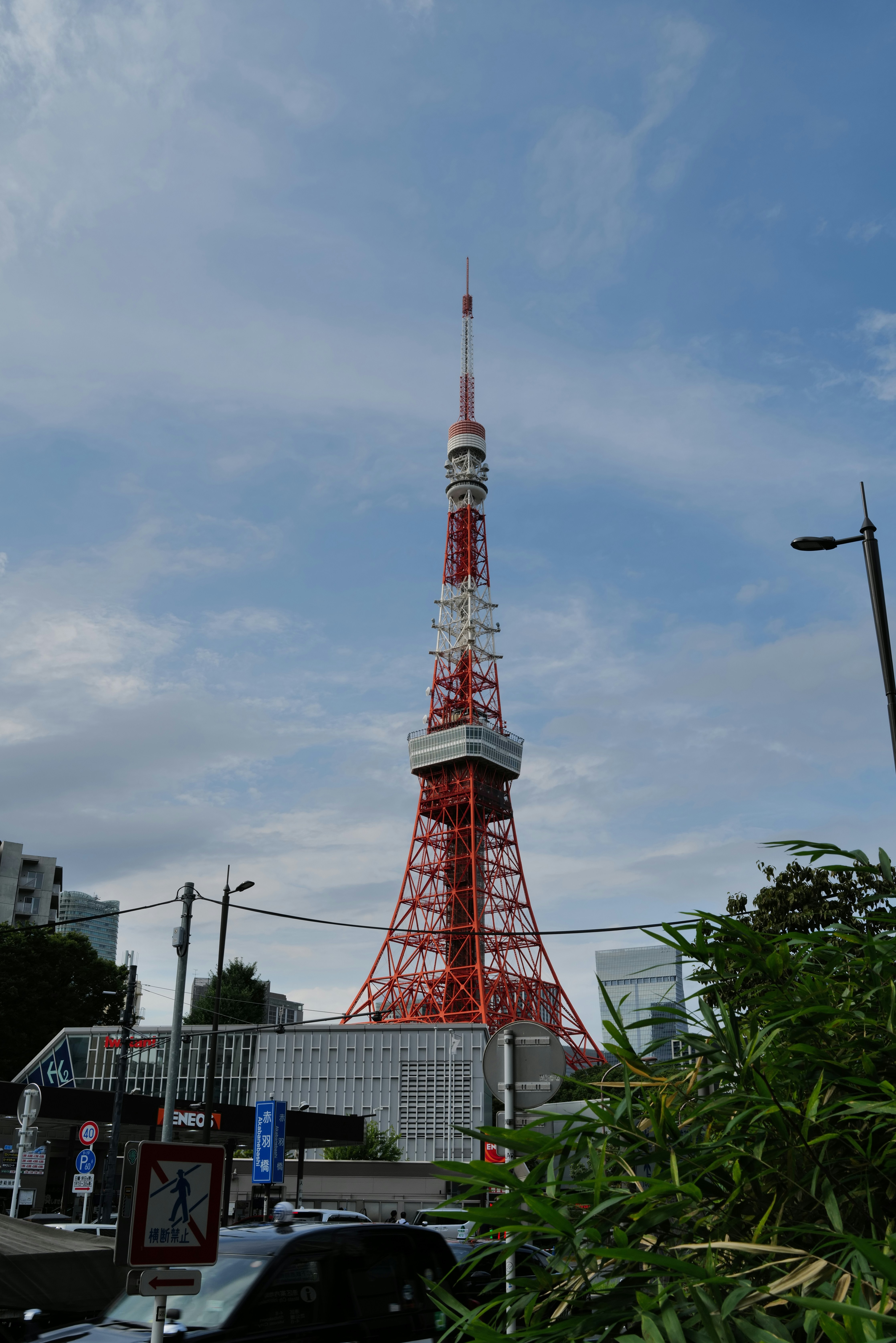 Tokyo Tower Reaching Skyward from a City Street
