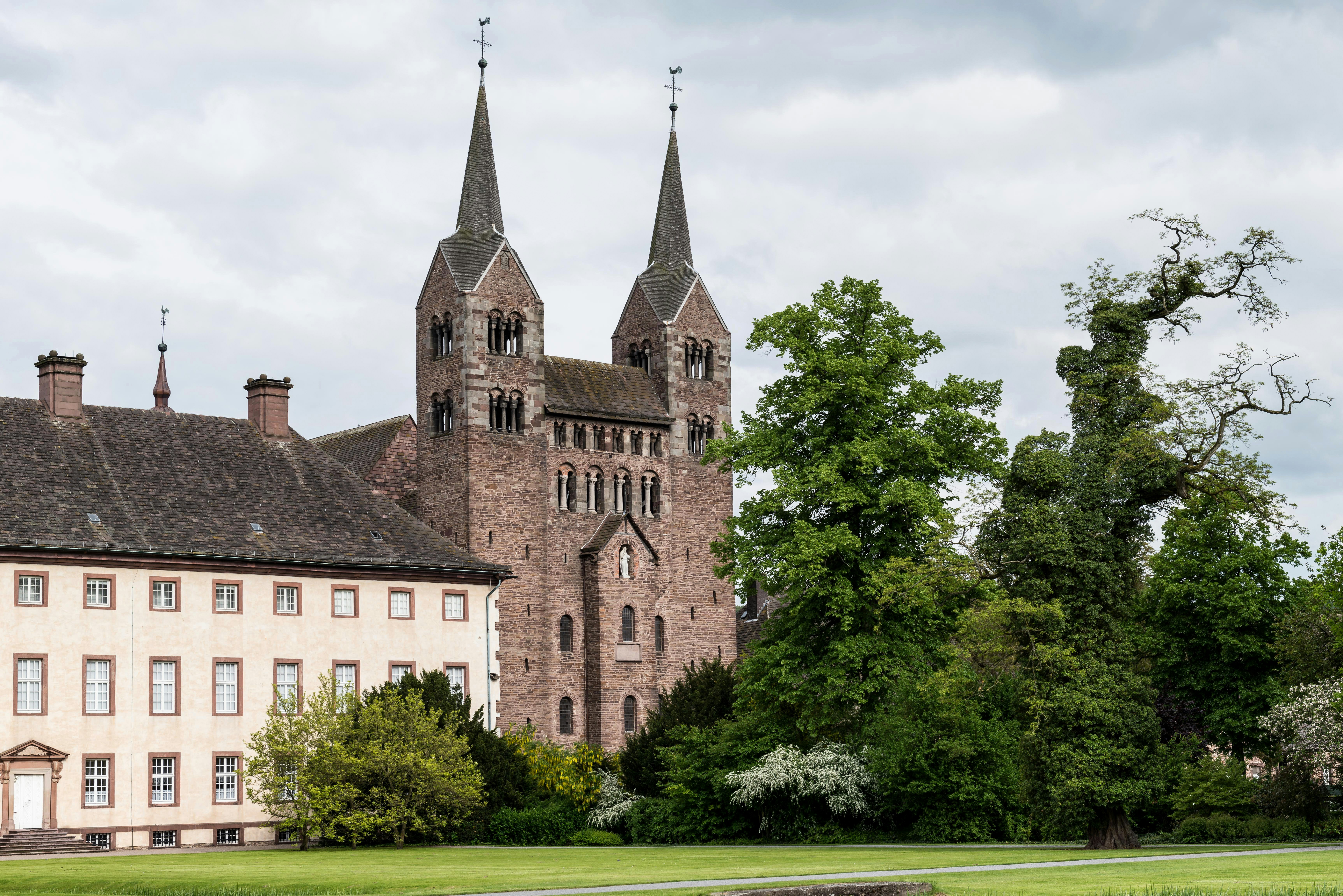 Twin Towers Over Green: A Historic Campus Castle Emerges from the Trees
