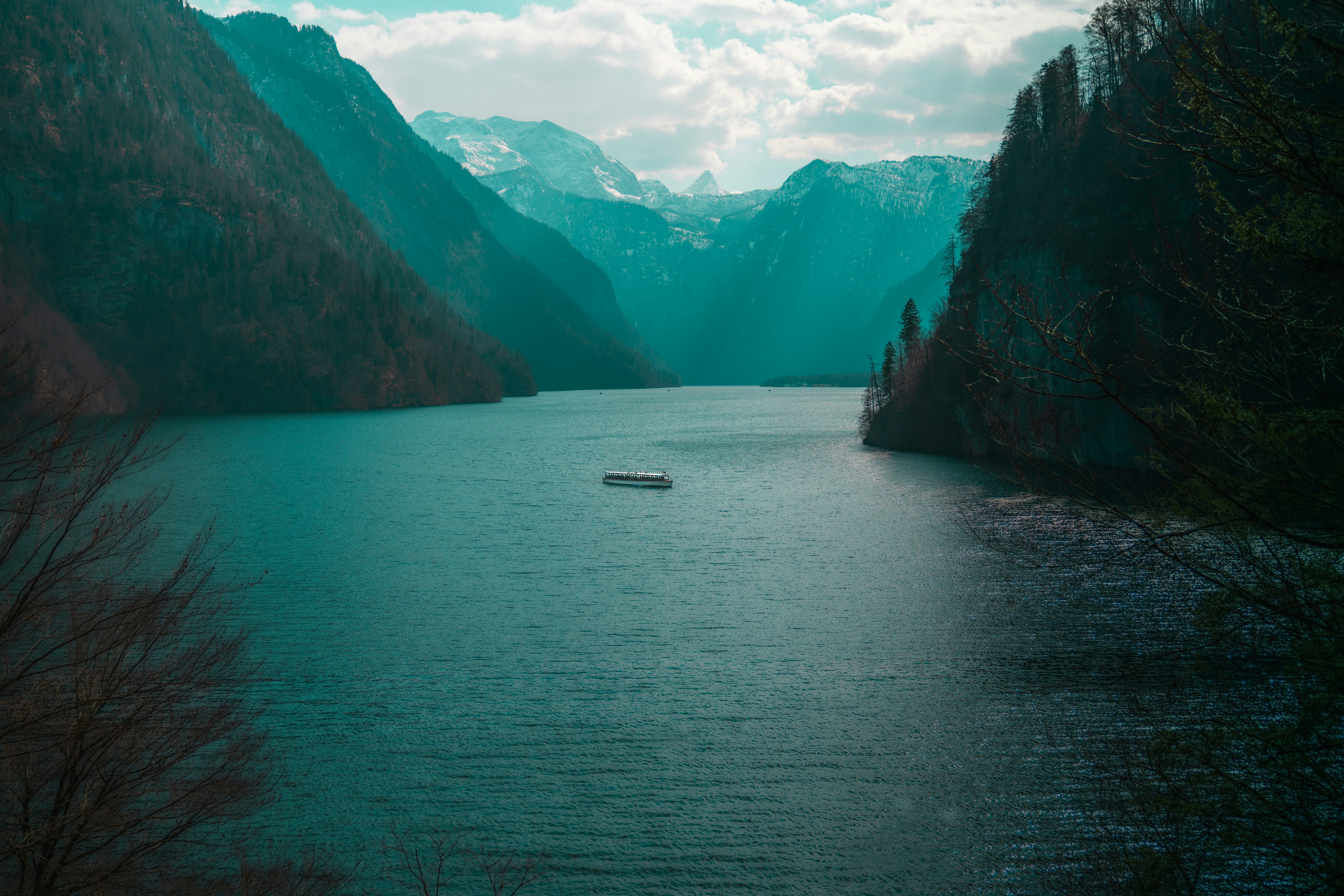 Sunken Boat Drifting Through Mountain Silence