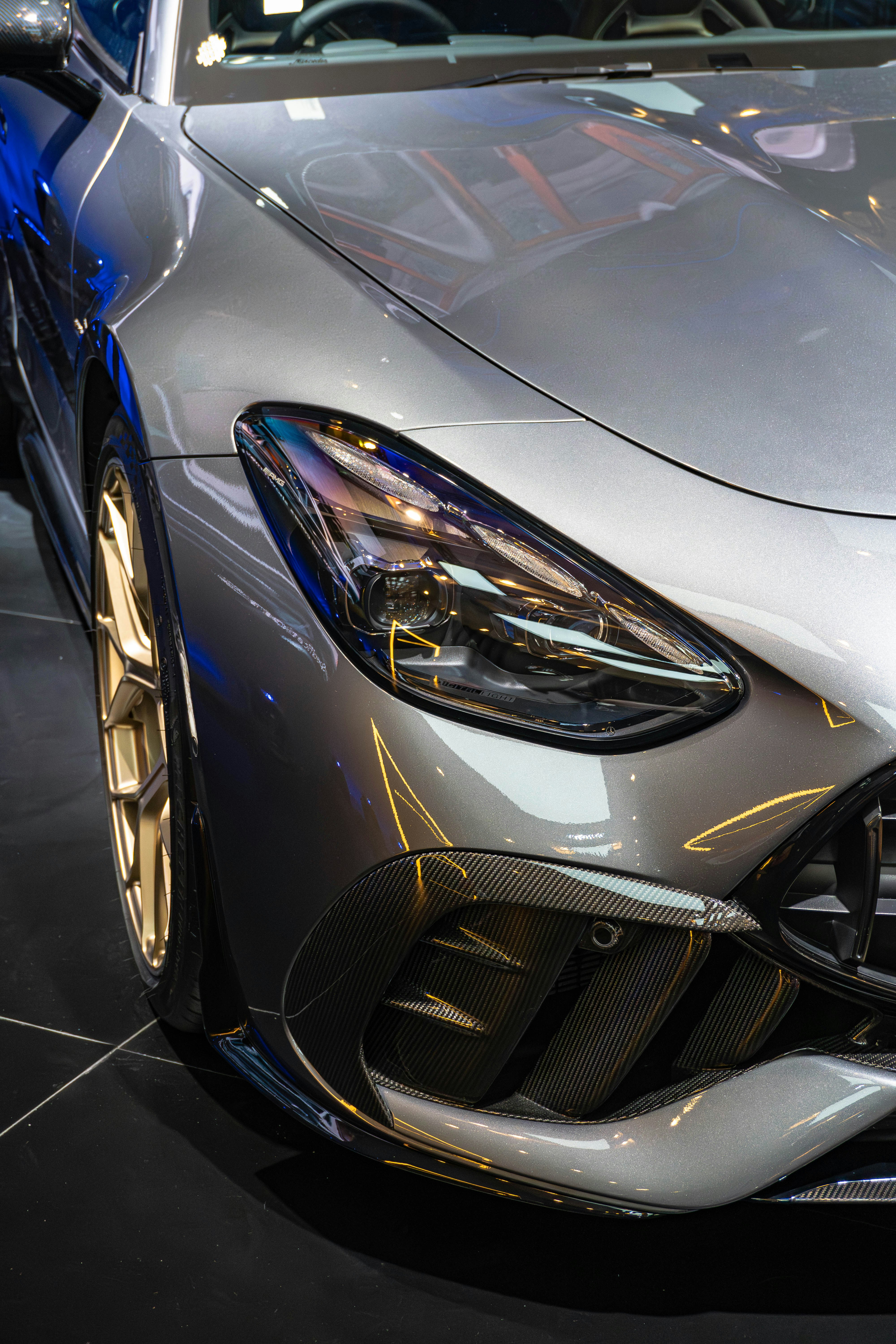 Sleek Aggression: The Front Quarter of a Silver Sports Car