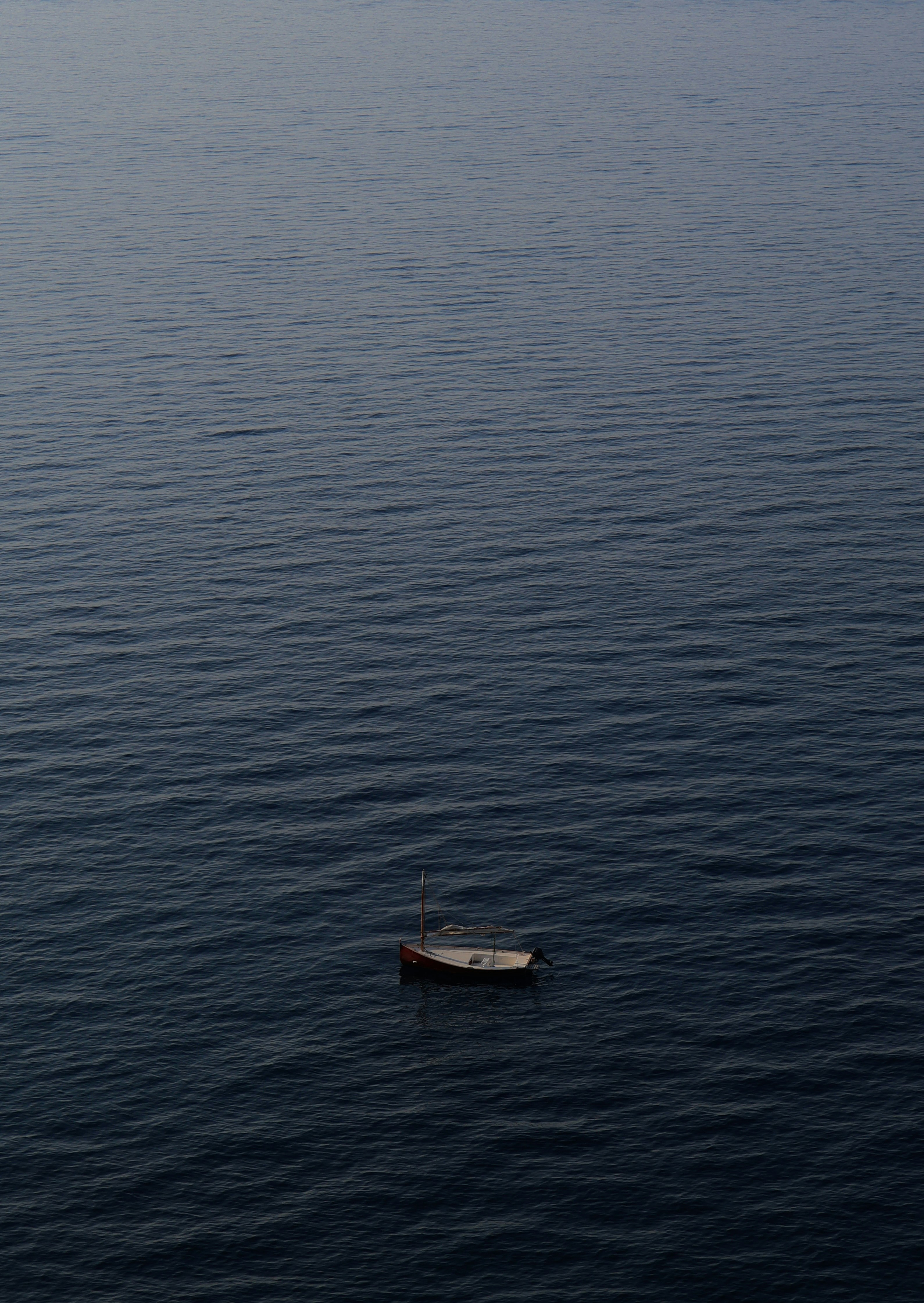 Boat Drifting in a Quiet Sea