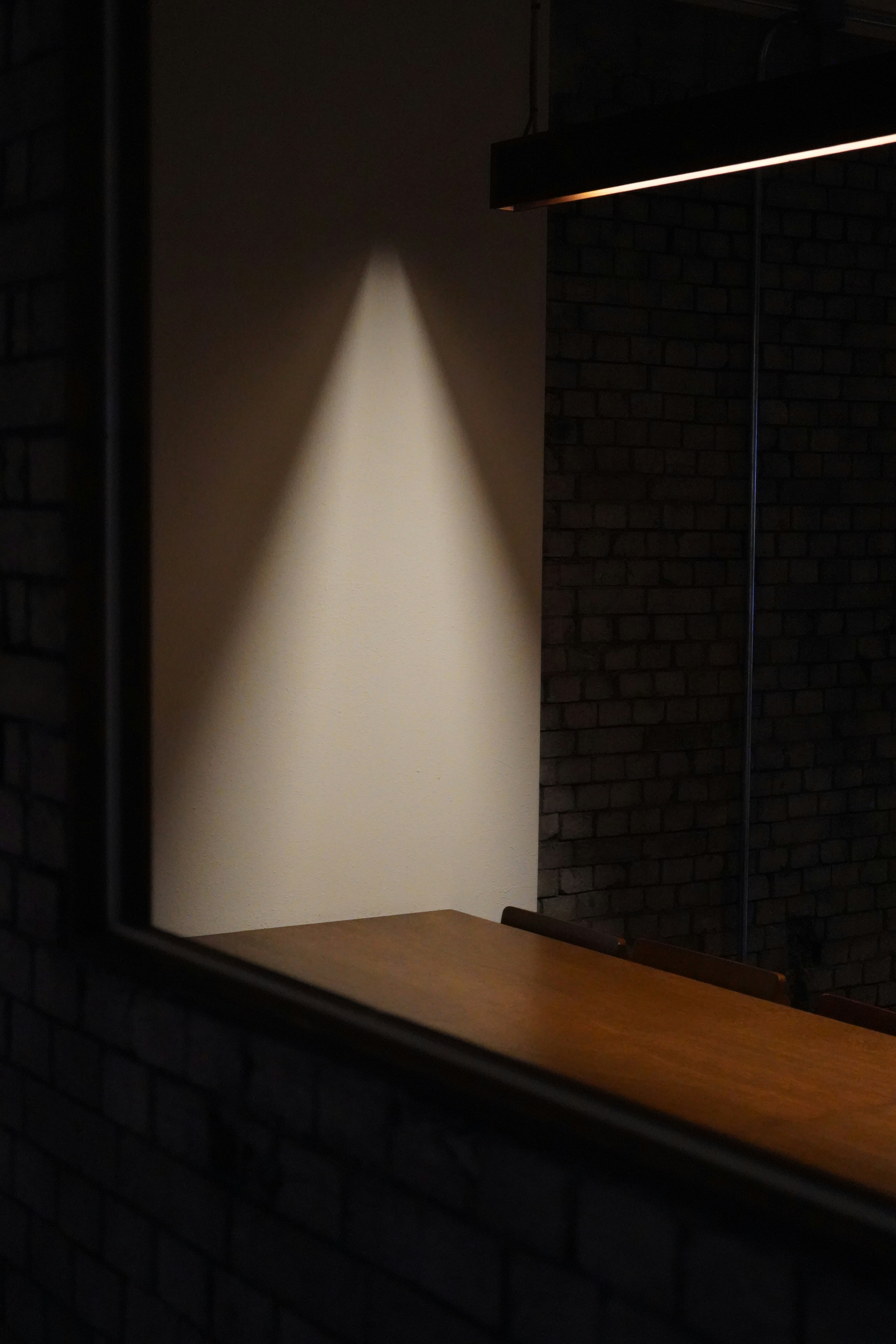 Shadowed Frame: A Corner of Light Inside a Dim loft